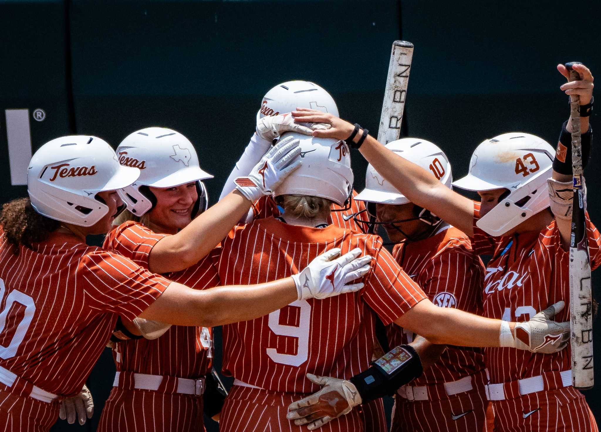 Texas softball takes on Michigan in NCAA Tournament: Best photos