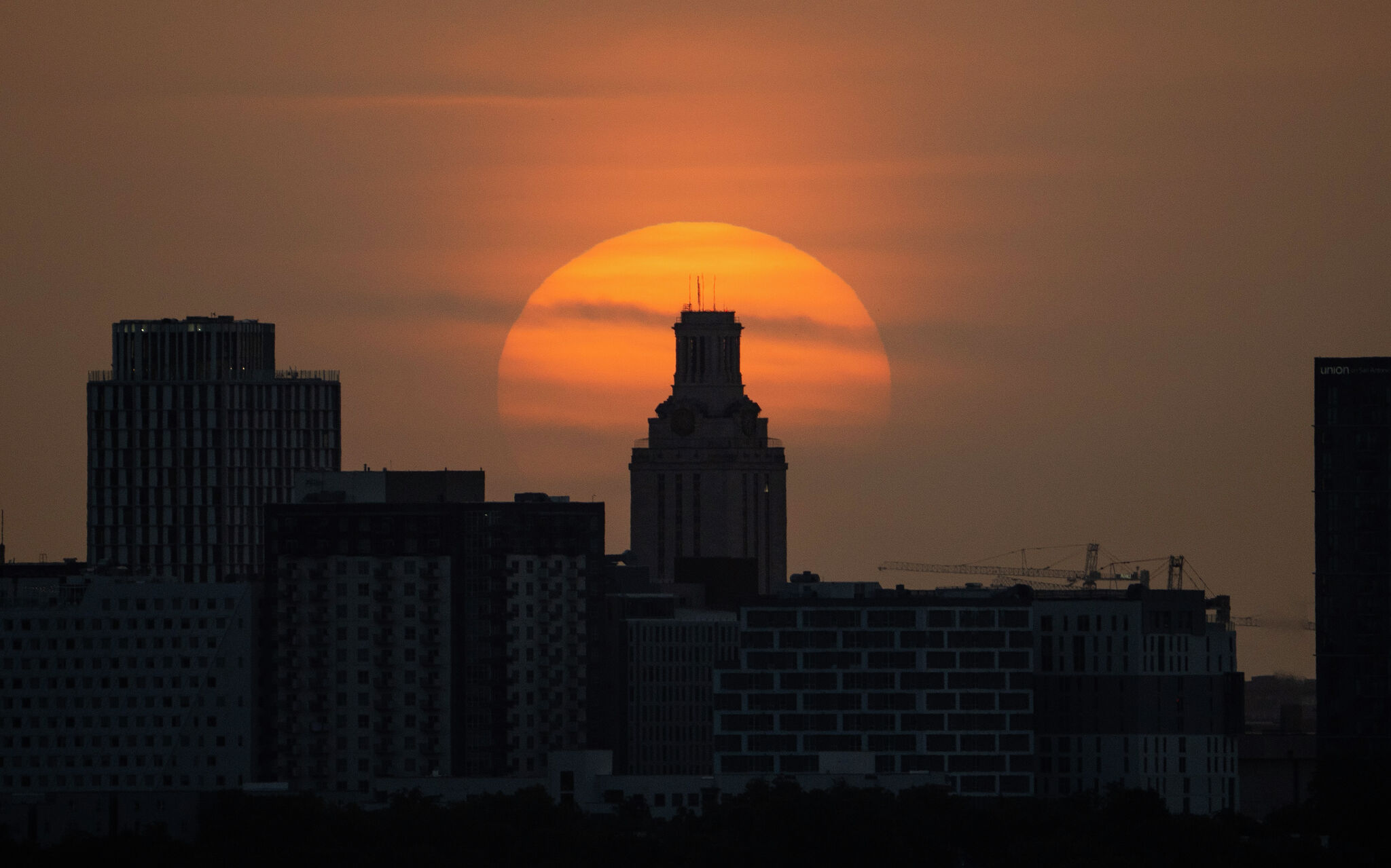 Why is the sky orange? How atmosphere influences sun's light particles