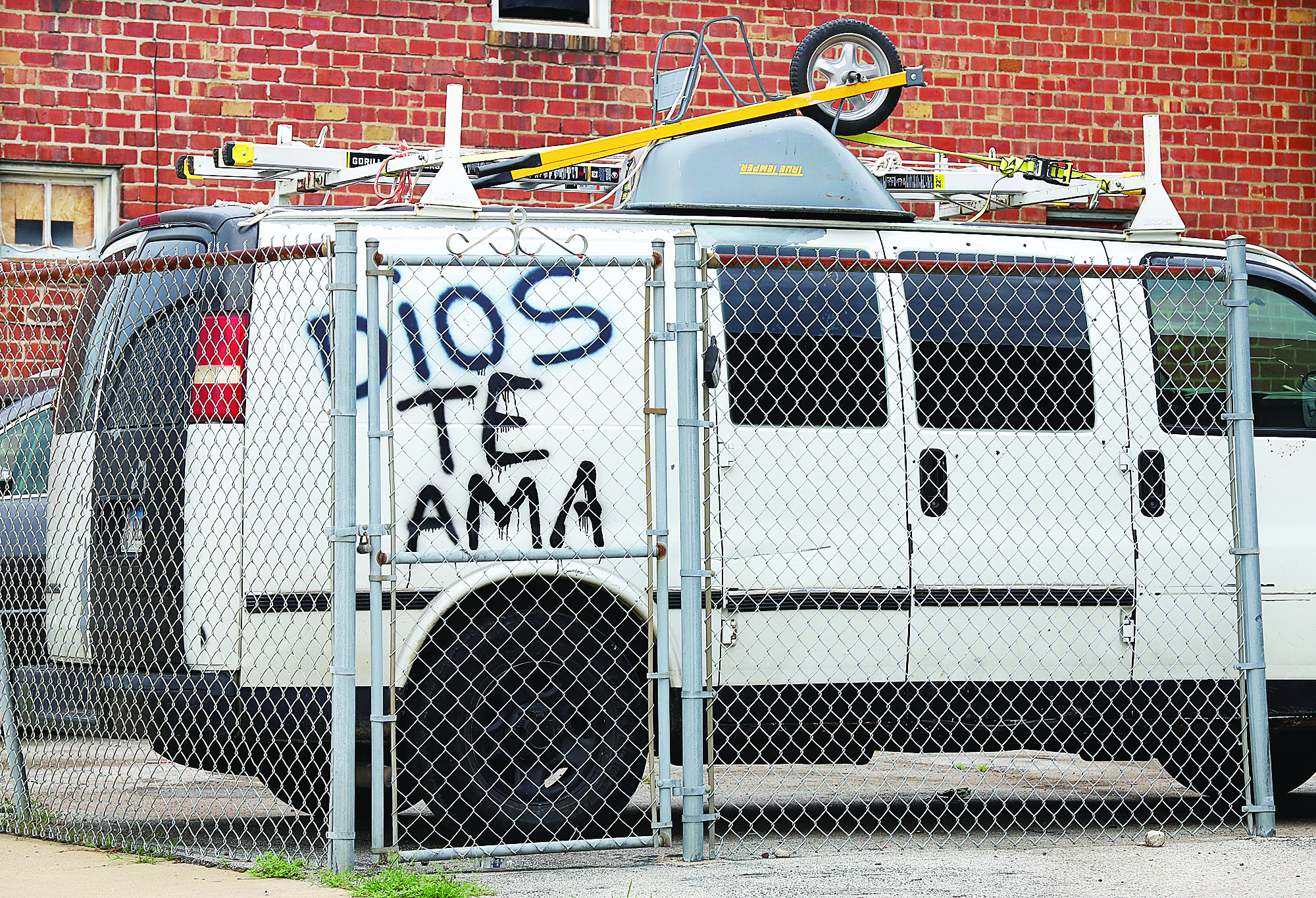 'Dios Te Ama' graffiti appears on van parked in Alton
