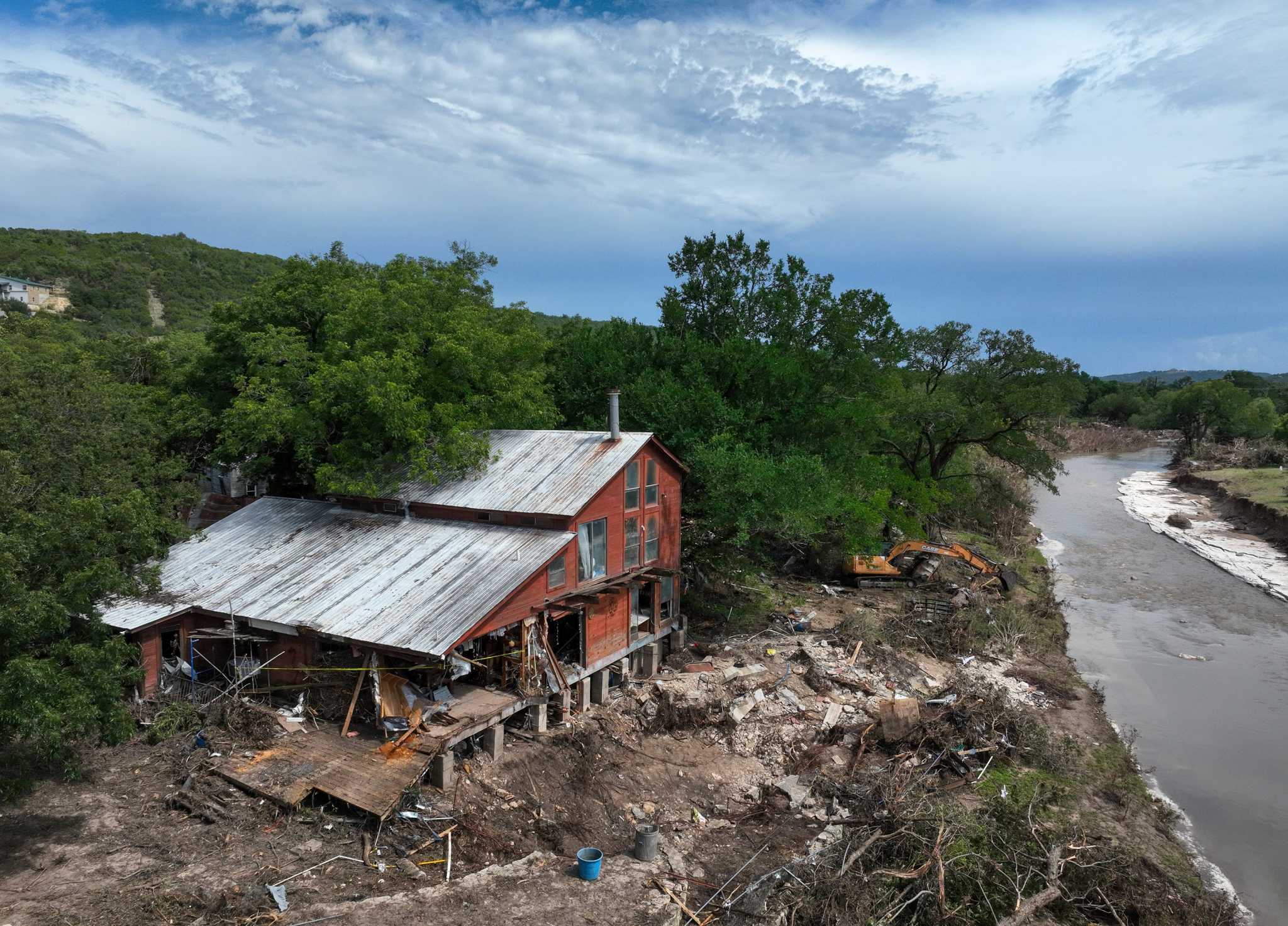 Texas flash floods prompt evacuations in Travis County. See photos