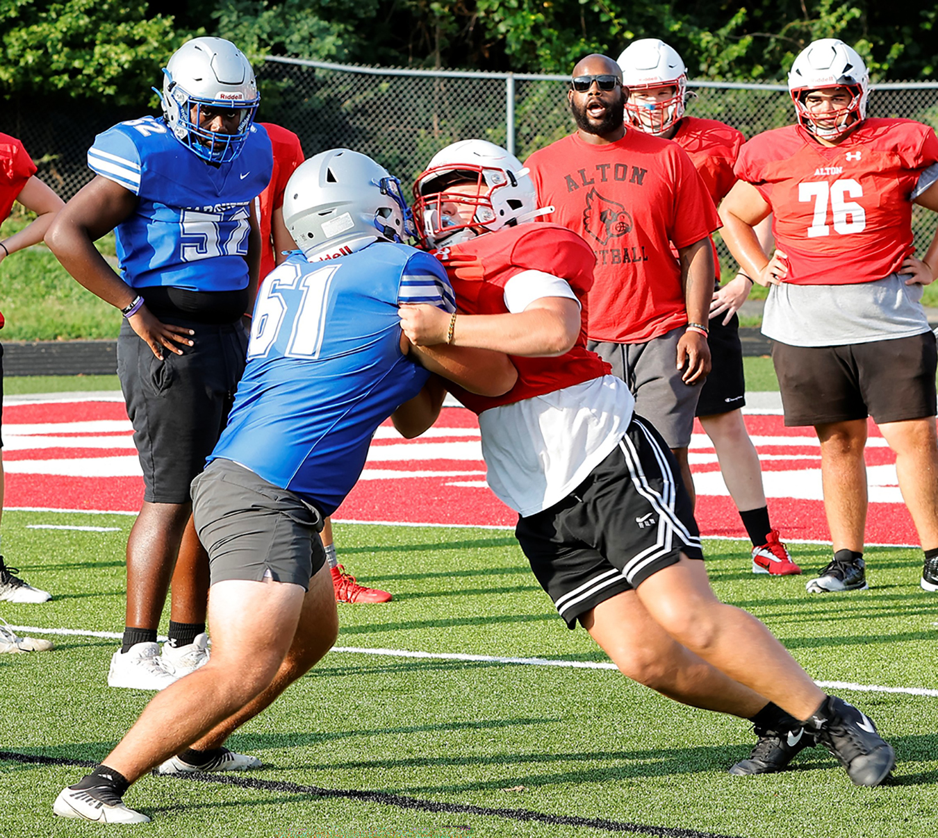 Alton, Marquette football teams hold joint summer scrimmage