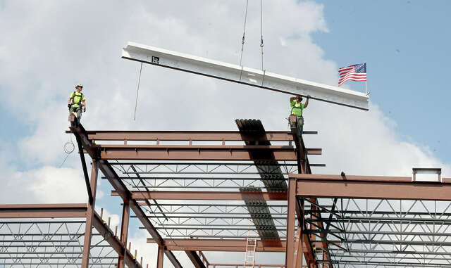 Manchester library reaches structural completion with beam ceremony