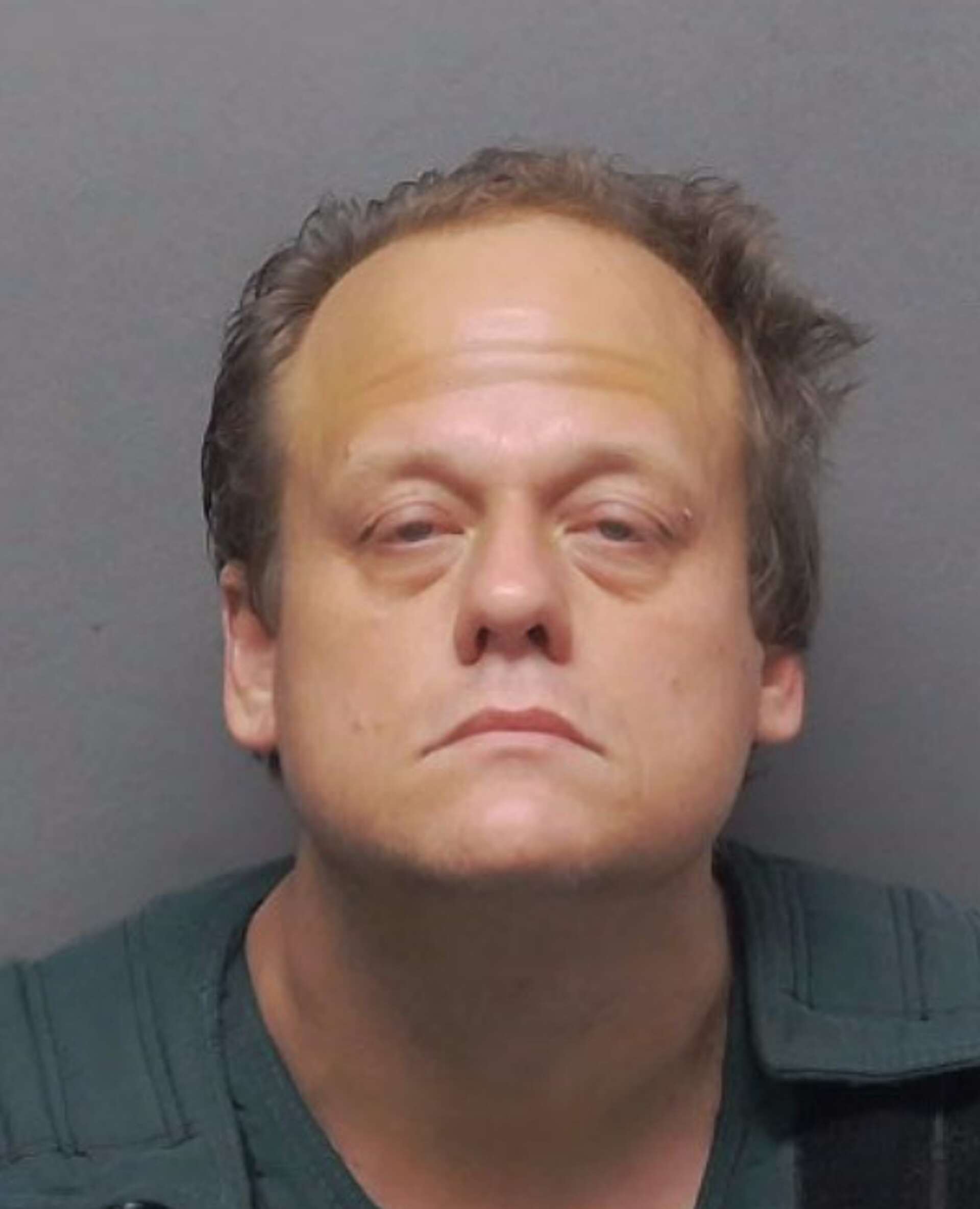 Man who lived with wife's corpse for month charged with murder
