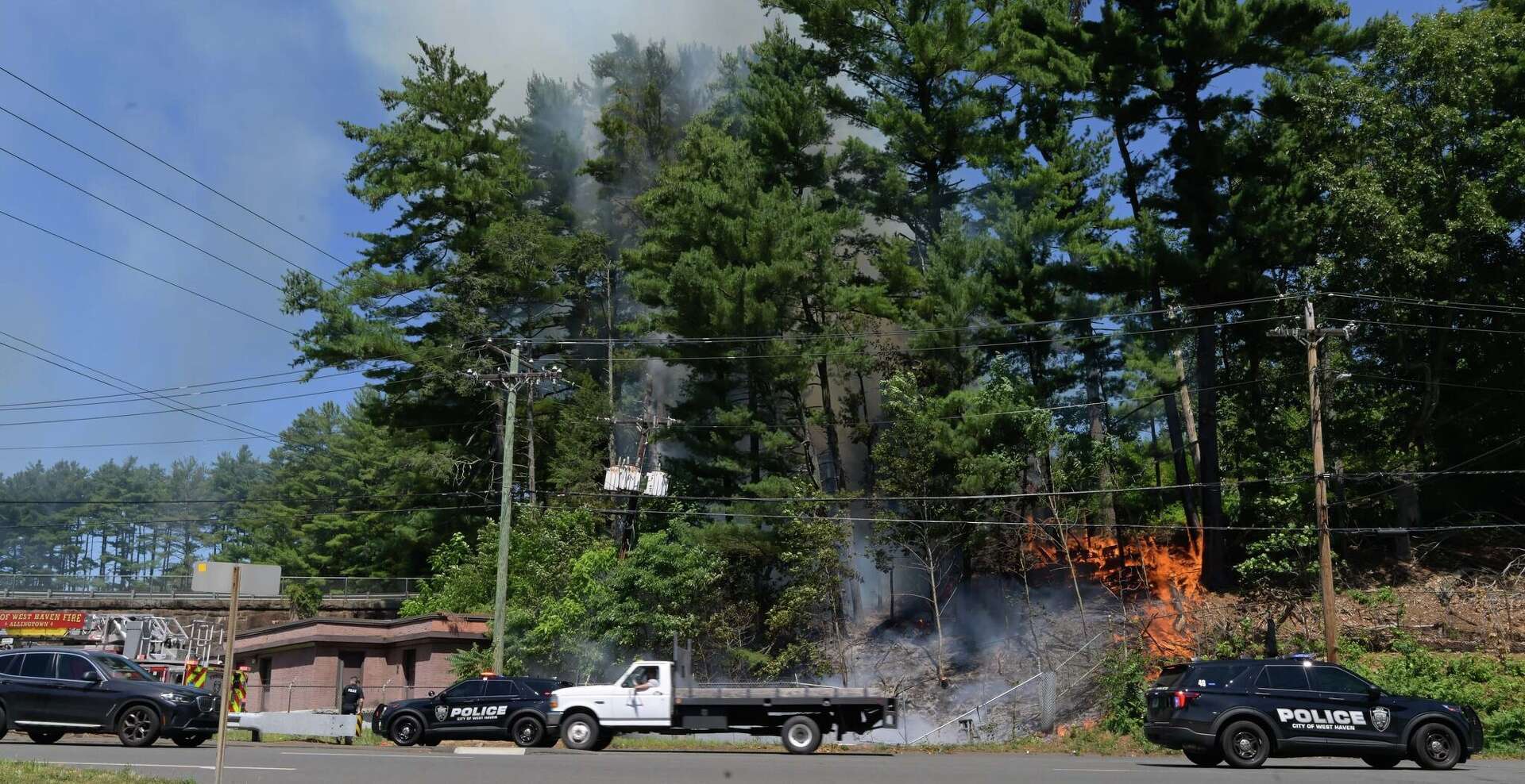 Large brush fire in West Haven closes Derby Avenue, police say