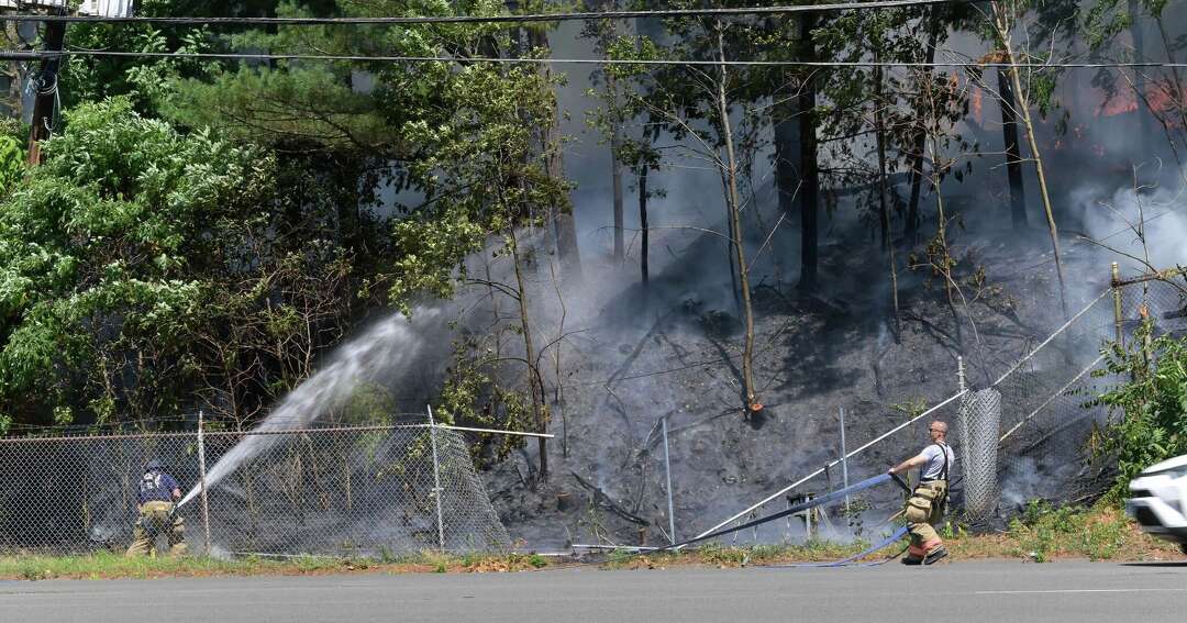 Large brush fire in West Haven closes Derby Avenue, police say