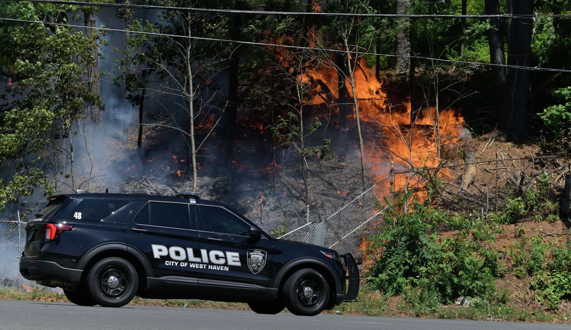 Large brush fire in West Haven closes Derby Avenue, police say