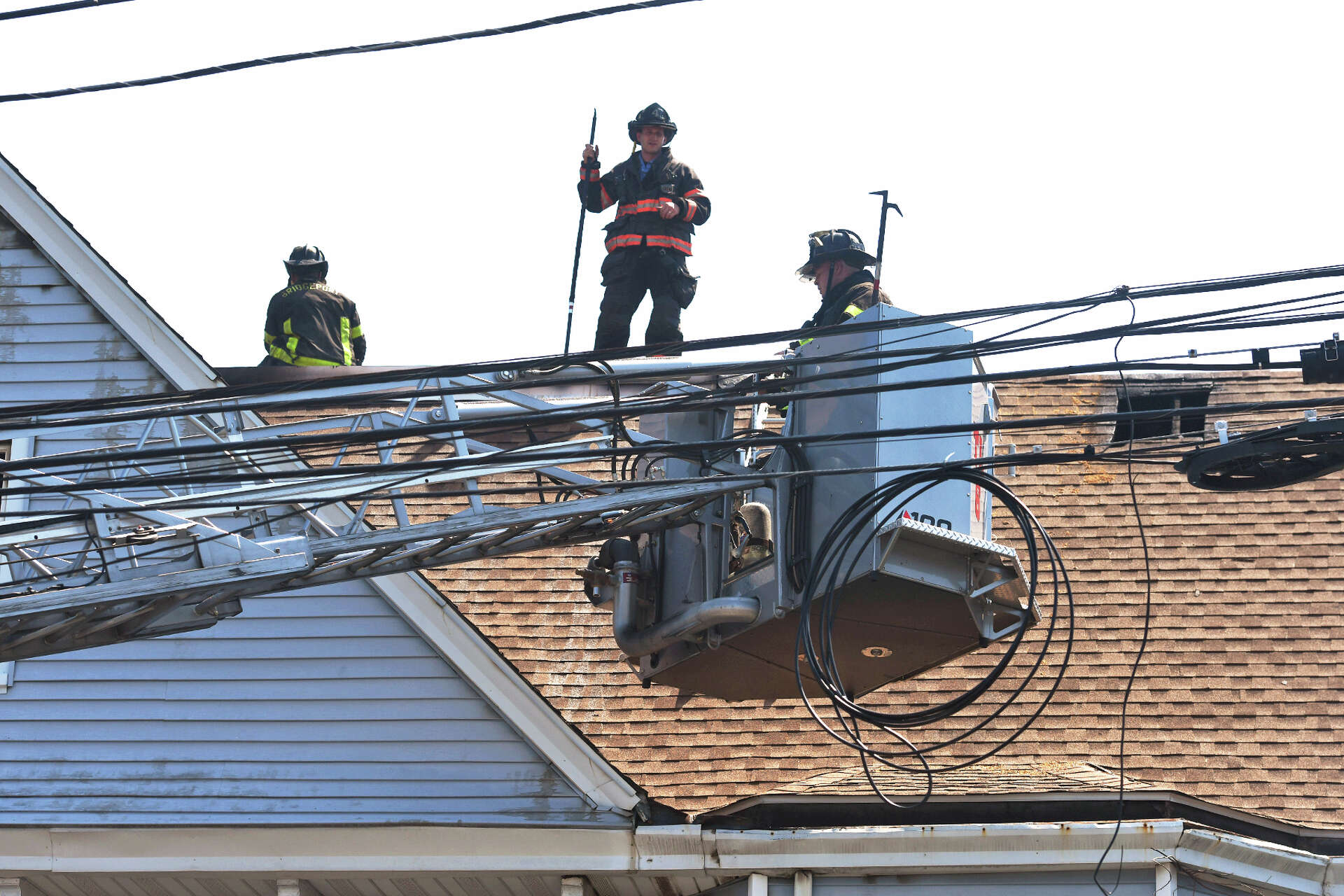 Bridgeport firefighters rescue 3 from roof of burning home: Official