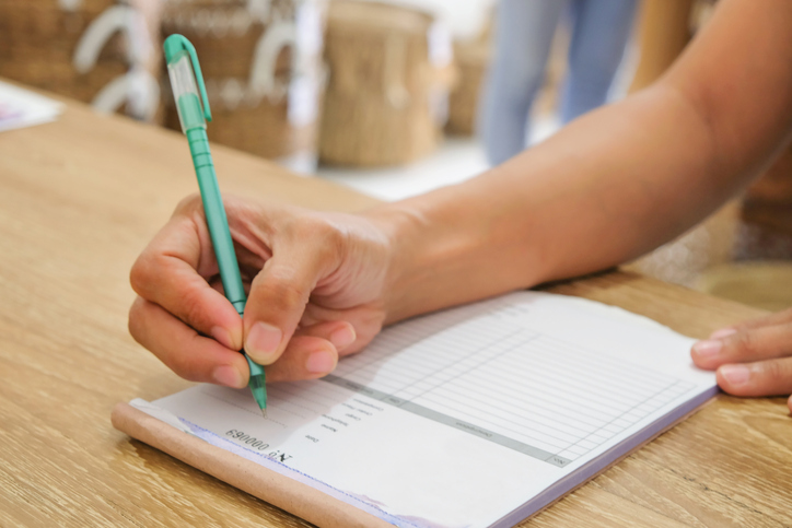 The checkbook's chill on the checkout line — Robin Garrison Leach