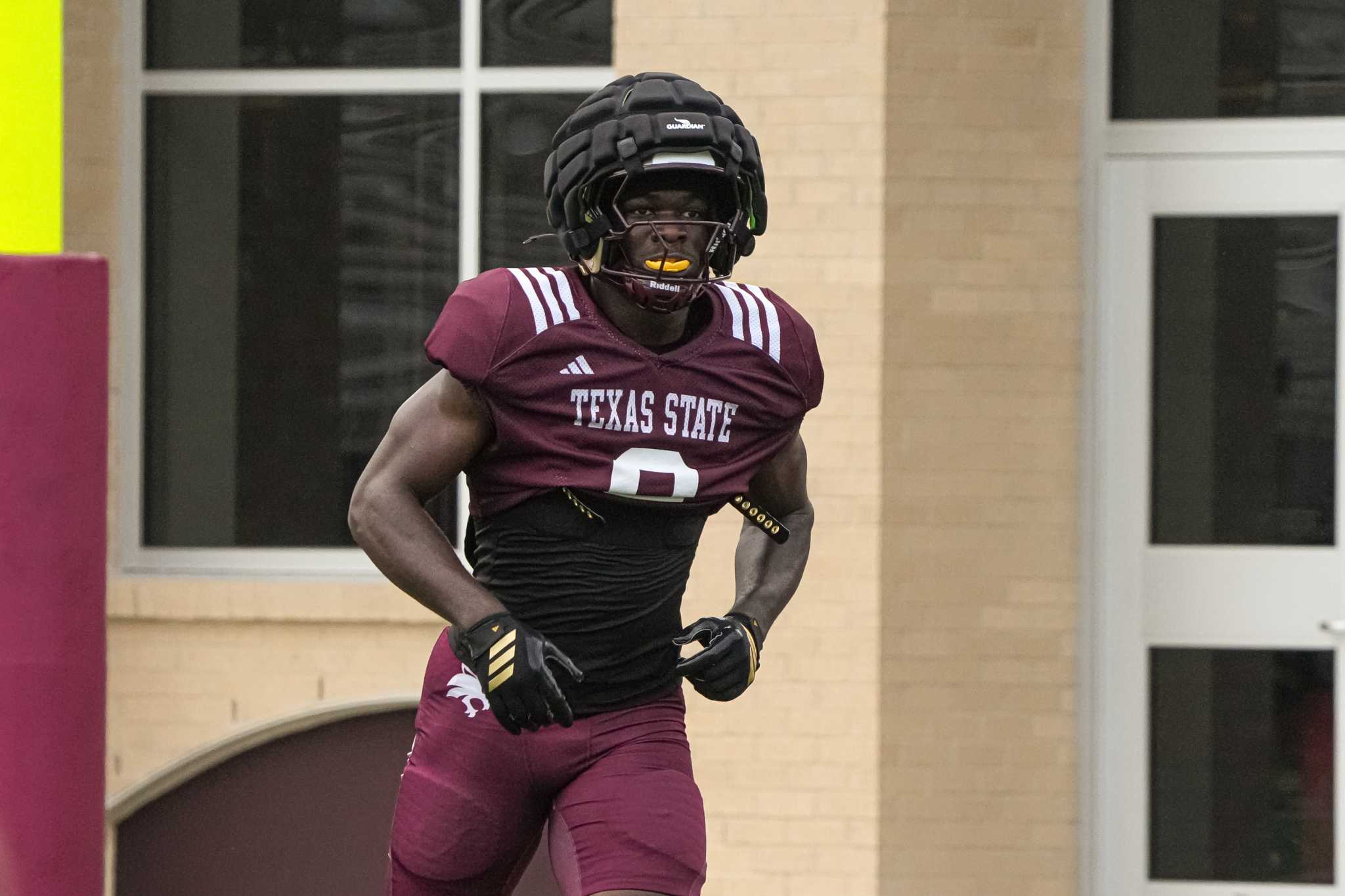 Greg Burrell, ex-Texas State RB, arrested on felony charge, per police