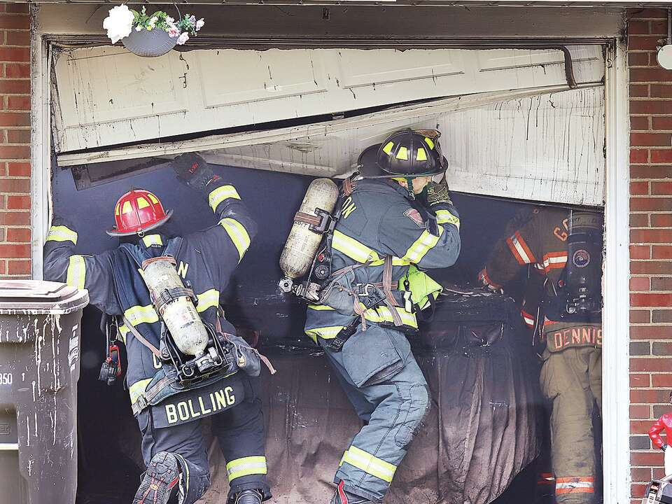 Godfrey house fire destroys vehicles, damages home on Paris Drive