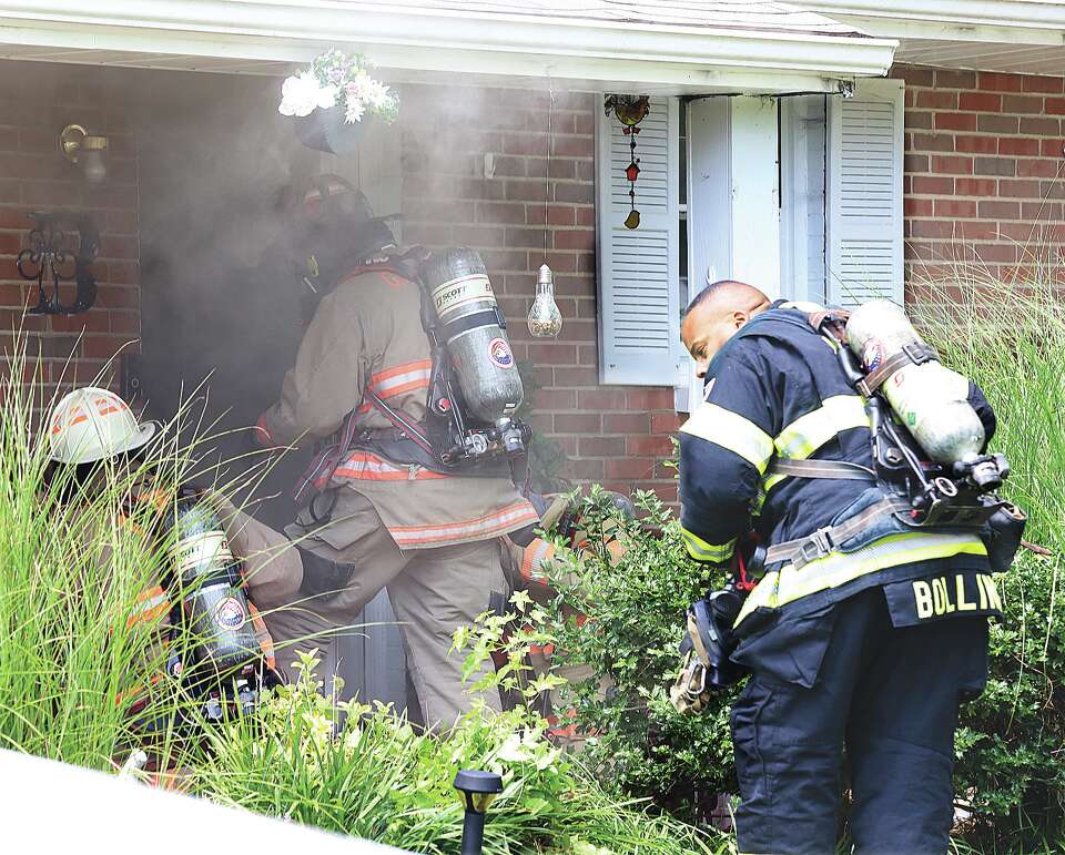 Godfrey house fire destroys vehicles, damages home on Paris Drive