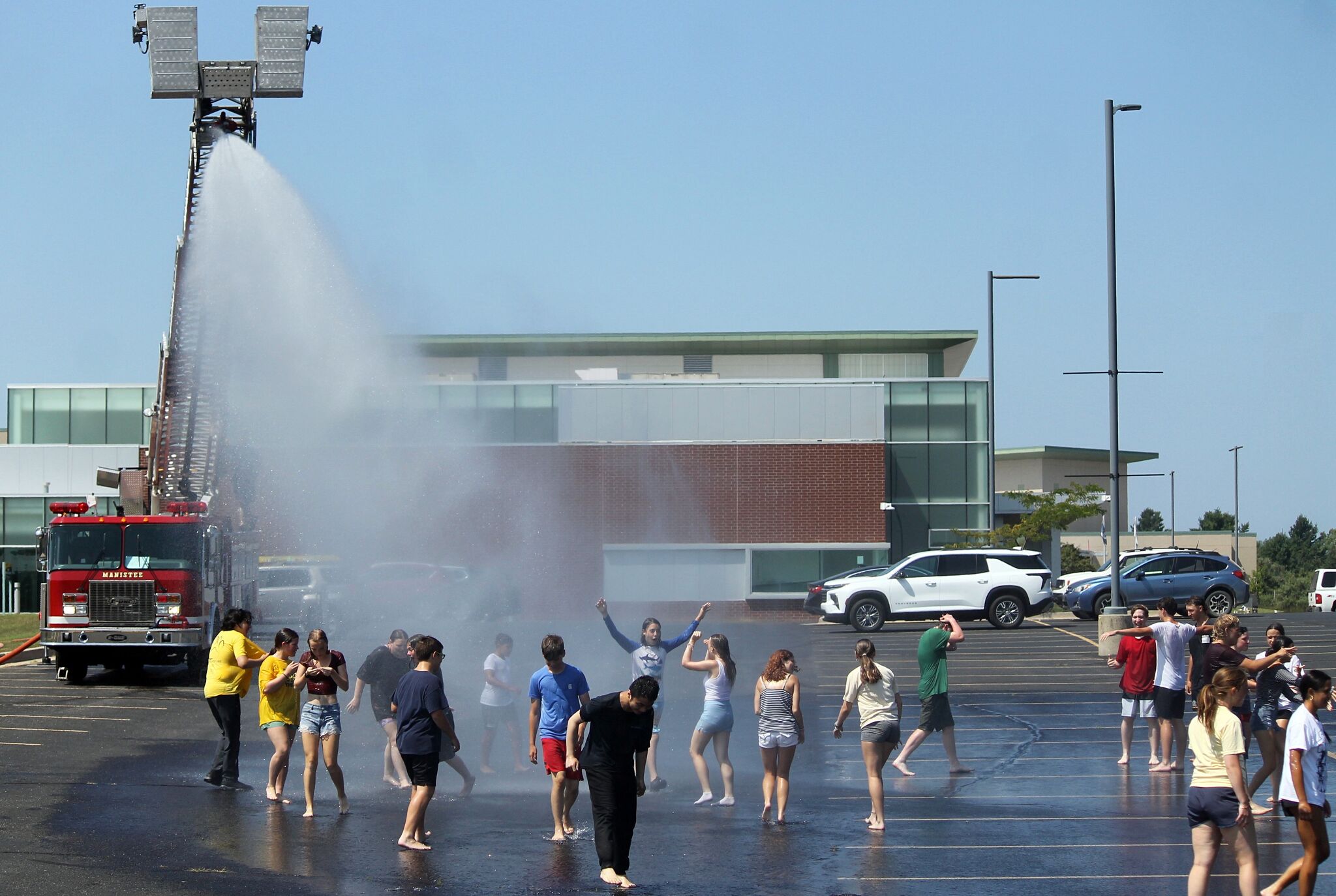 Manistee City Fire Department helps band campers keep cool