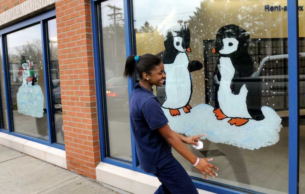 Students paint holiday windows