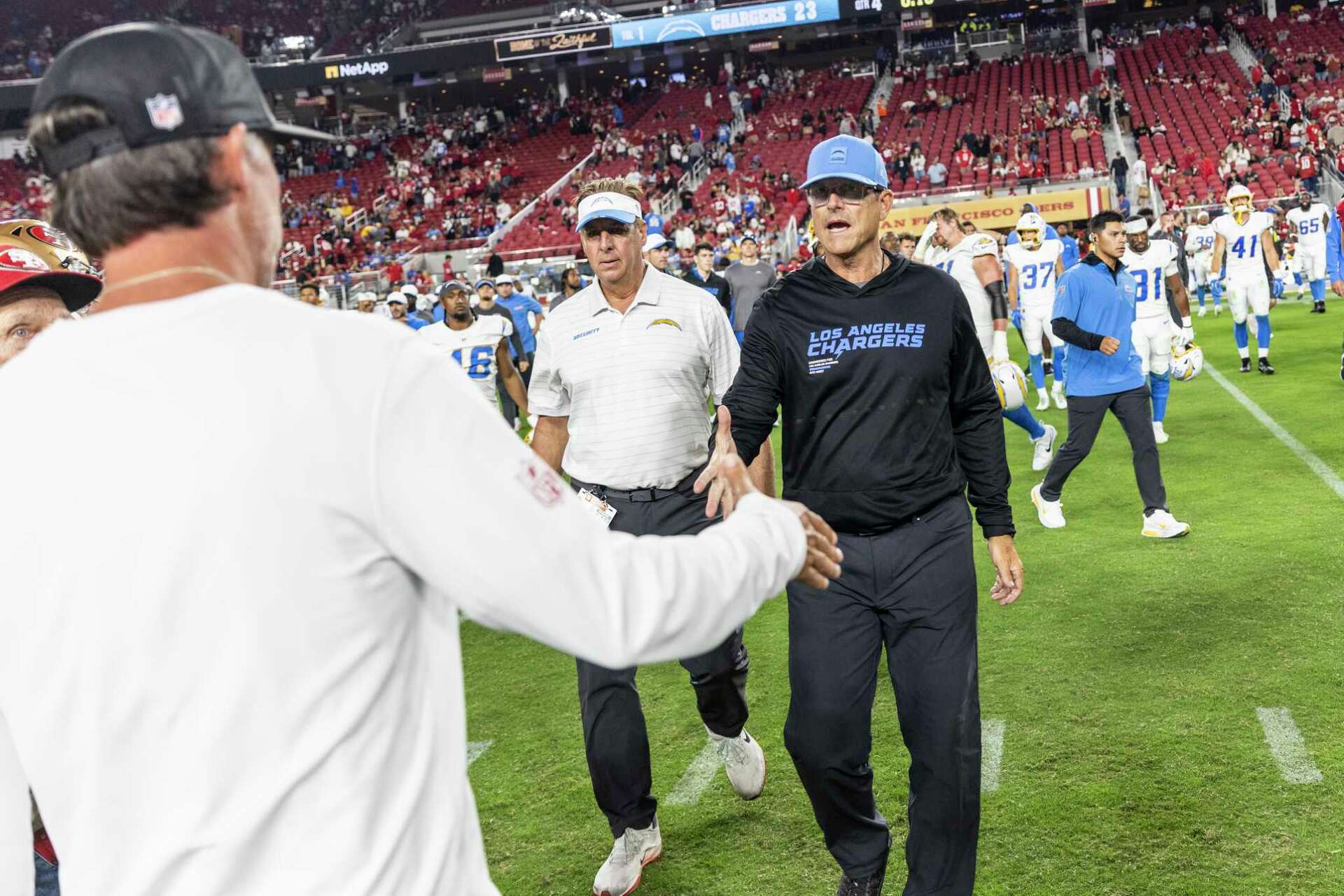 Former 49ers coach Harbaugh sees sunny side of Levi’s with Chargers
