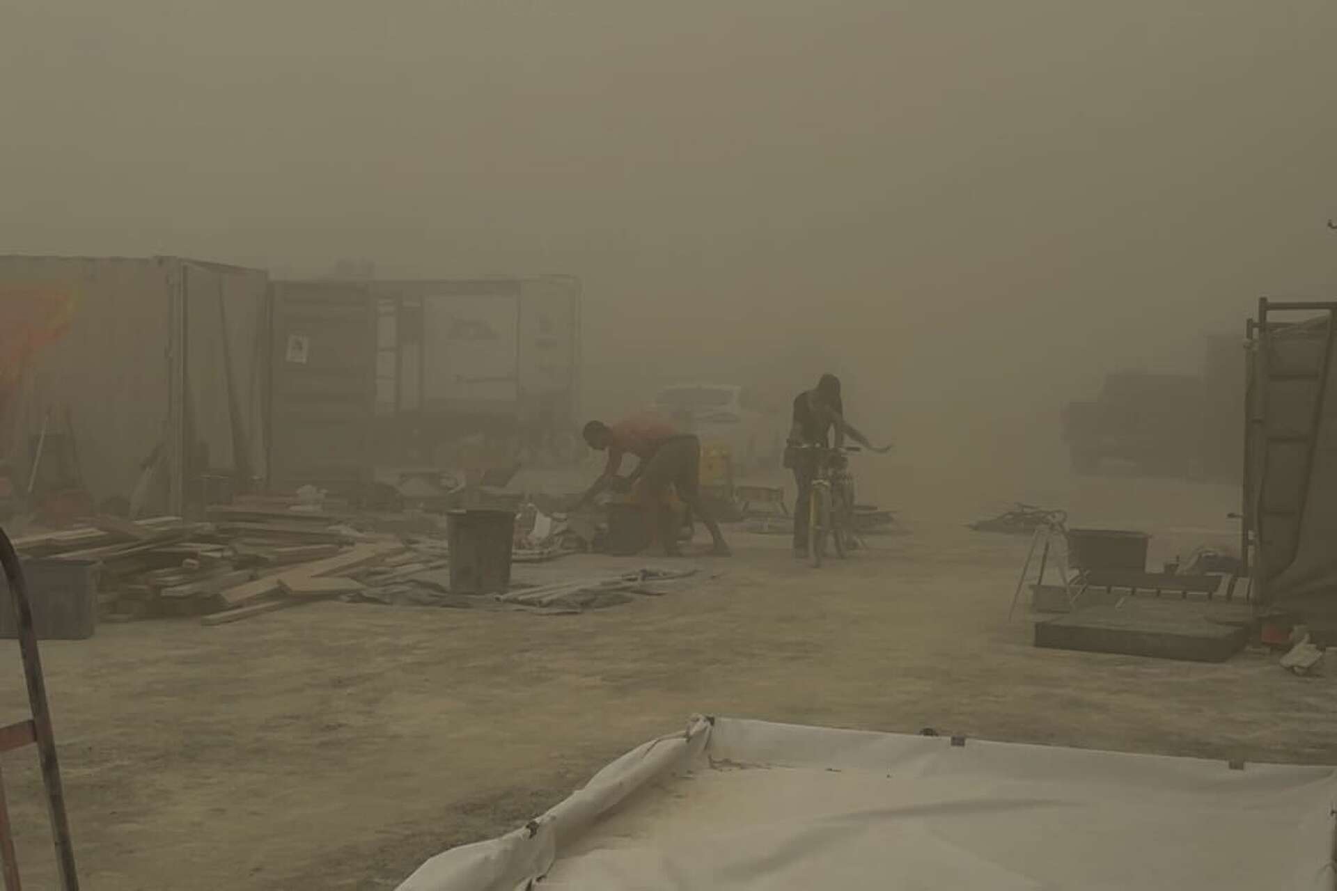 Burning Man dust storm flips tents, installations — flood risk warned