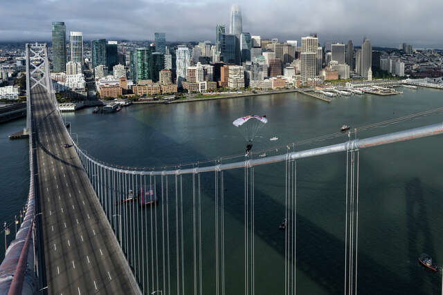 Man drops onto Bay Bridge suspension cables for jaw-dropping stunt