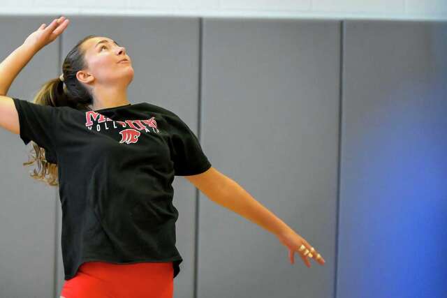 Photos of Darien, Masuk, Southington and Farmington girls volleyball