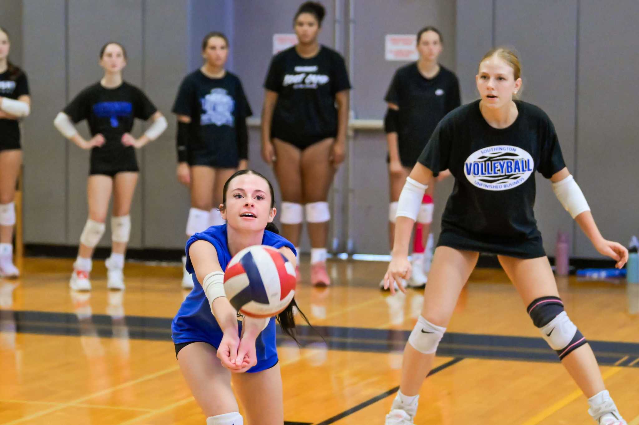 Photos of Darien, Masuk, Southington and Farmington girls volleyball