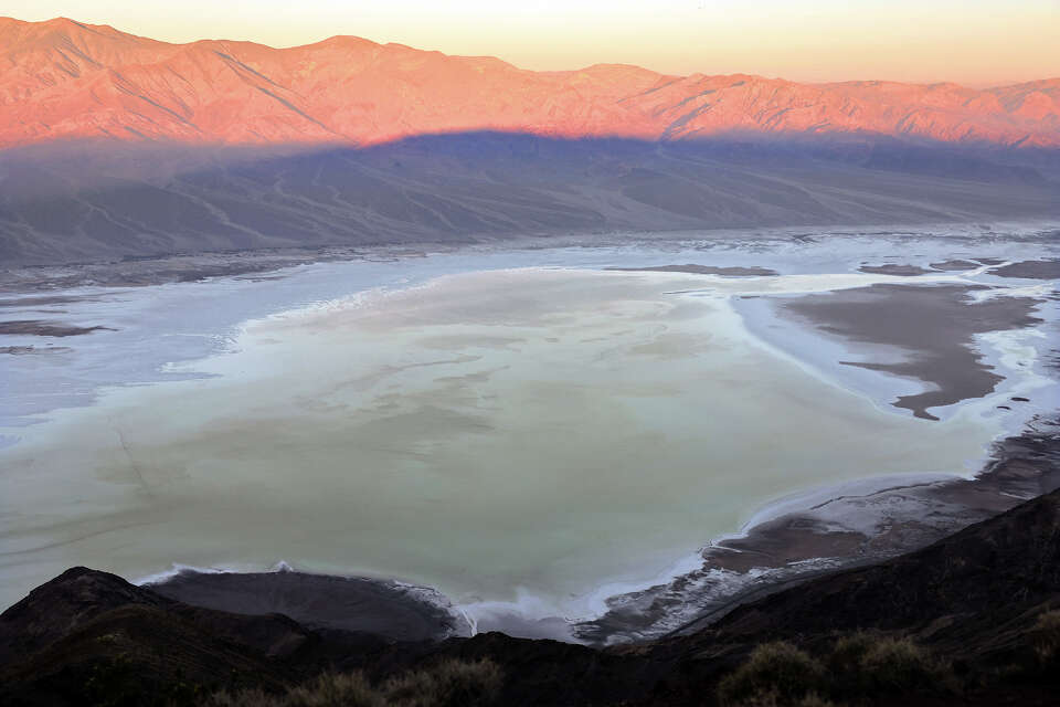 Death Valley under flash flood watch as triple-digit heat