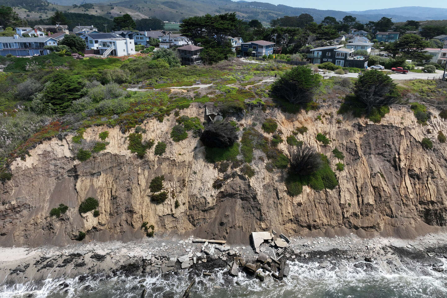 California fault lines, crumbling cliffs tear coastal area apart