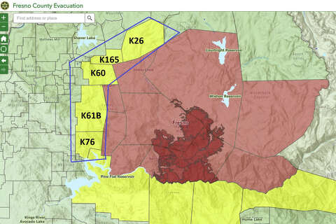 Smoke blankets Calif. mountain towns as Garnet Fire explodes