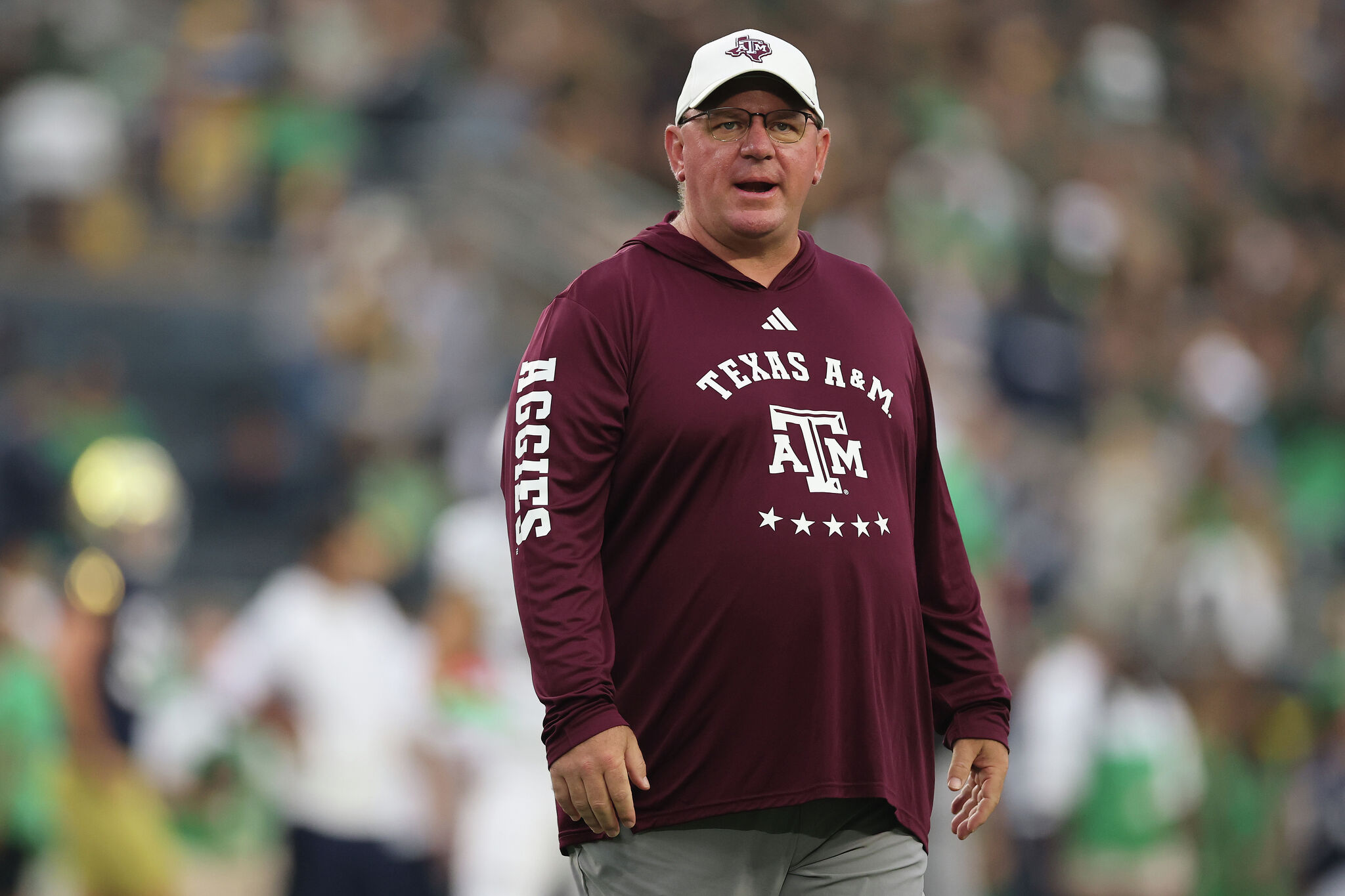 Texas A&M coach Mike Elko throws chair during Notre Dame game