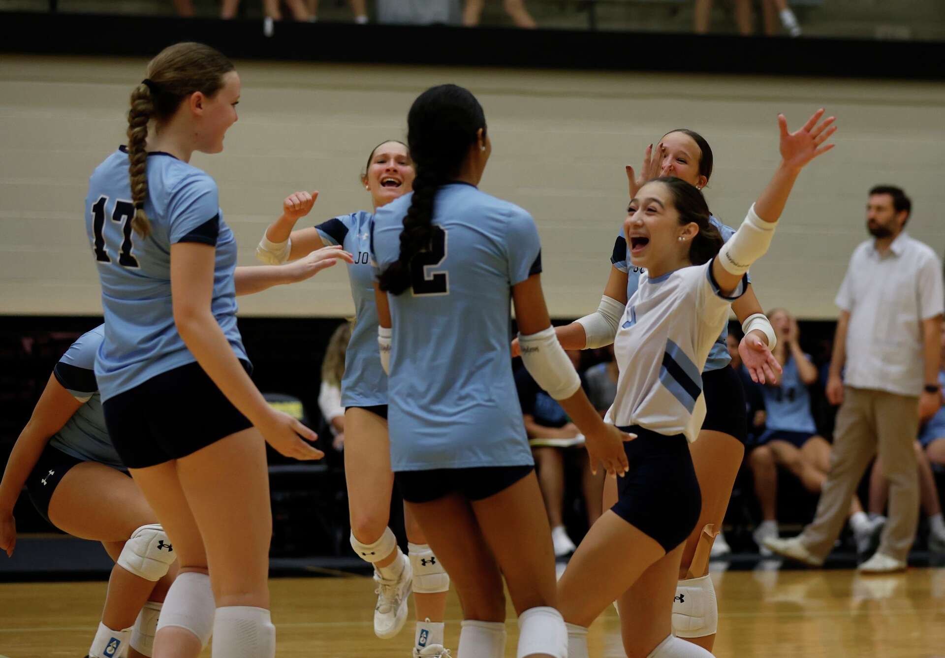 Reagan volleyball grinds out four-set victory against rival Johnson