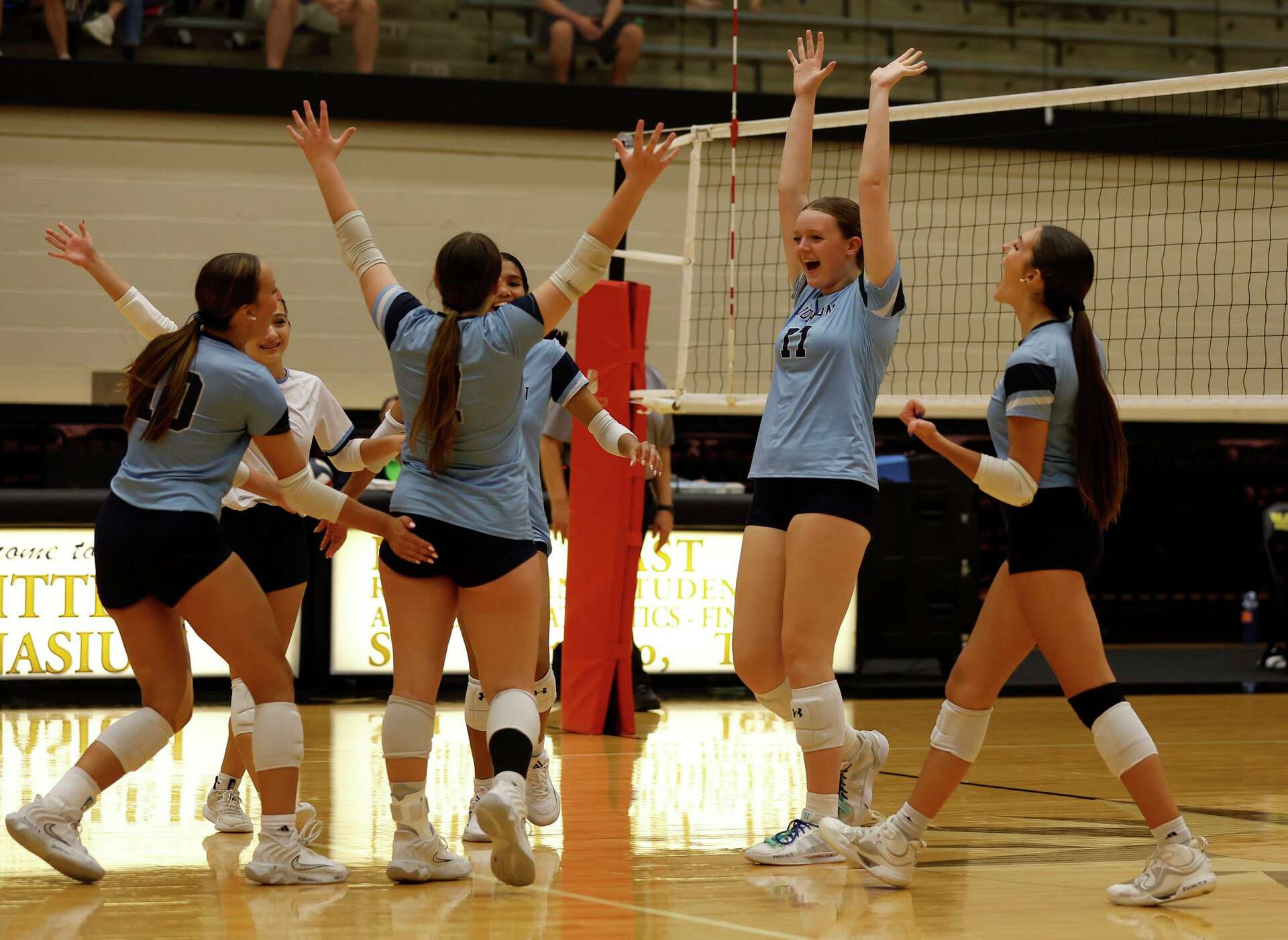 Reagan volleyball grinds out four-set victory against rival Johnson