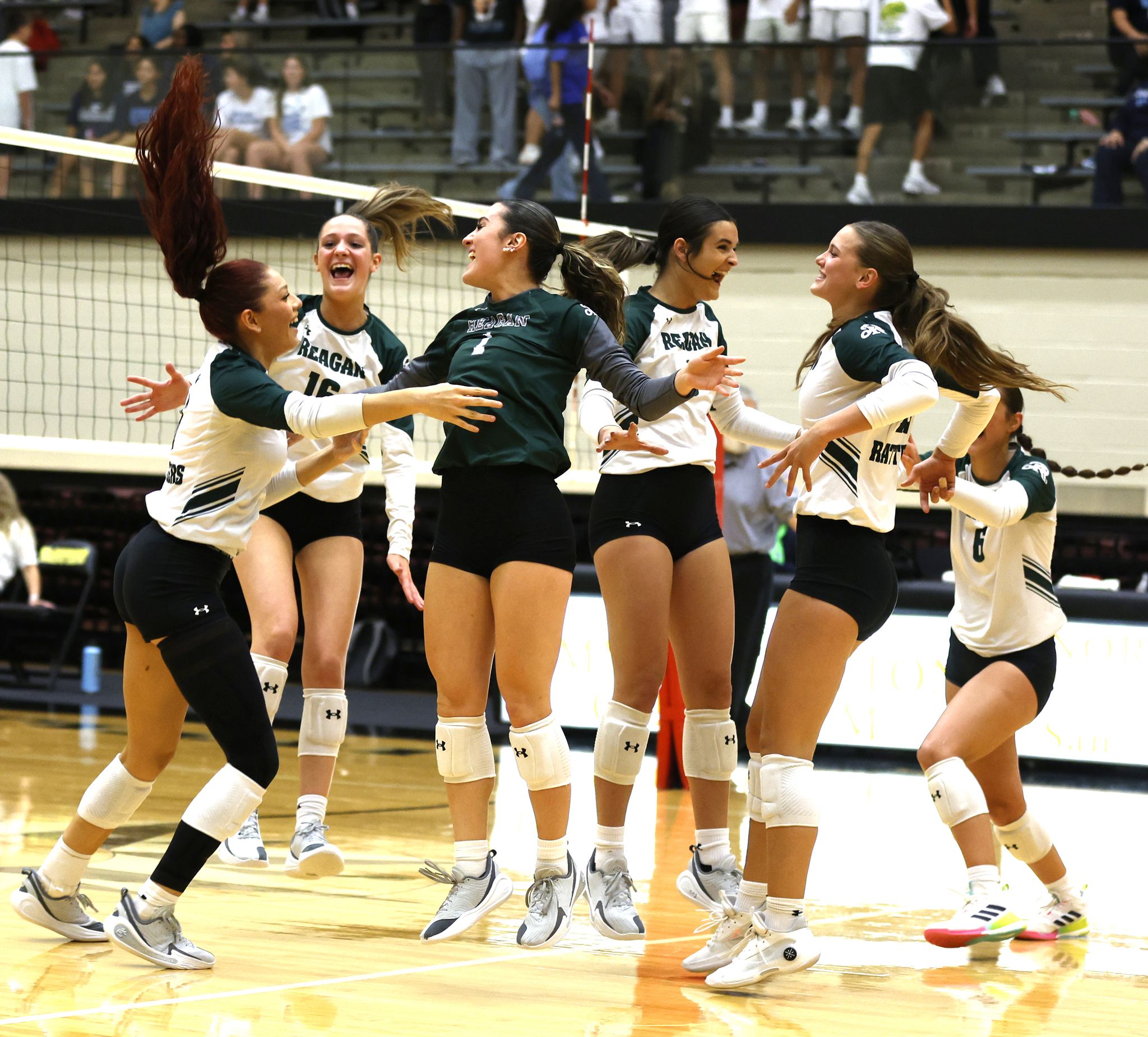 Reagan volleyball grinds out four-set victory against rival Johnson
