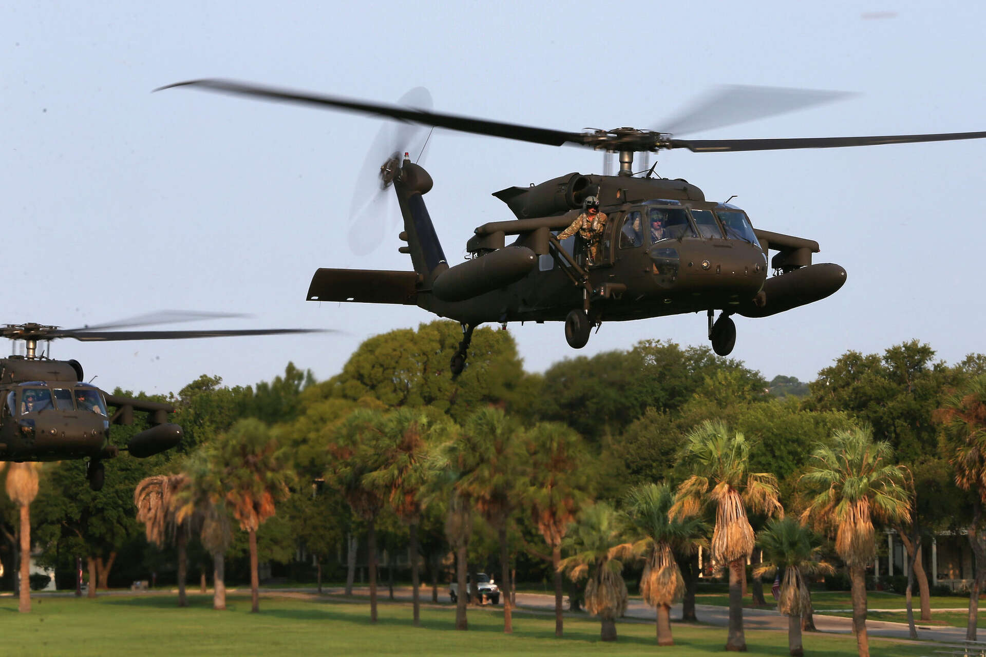 Why are military helicopters flying low in Houston?
