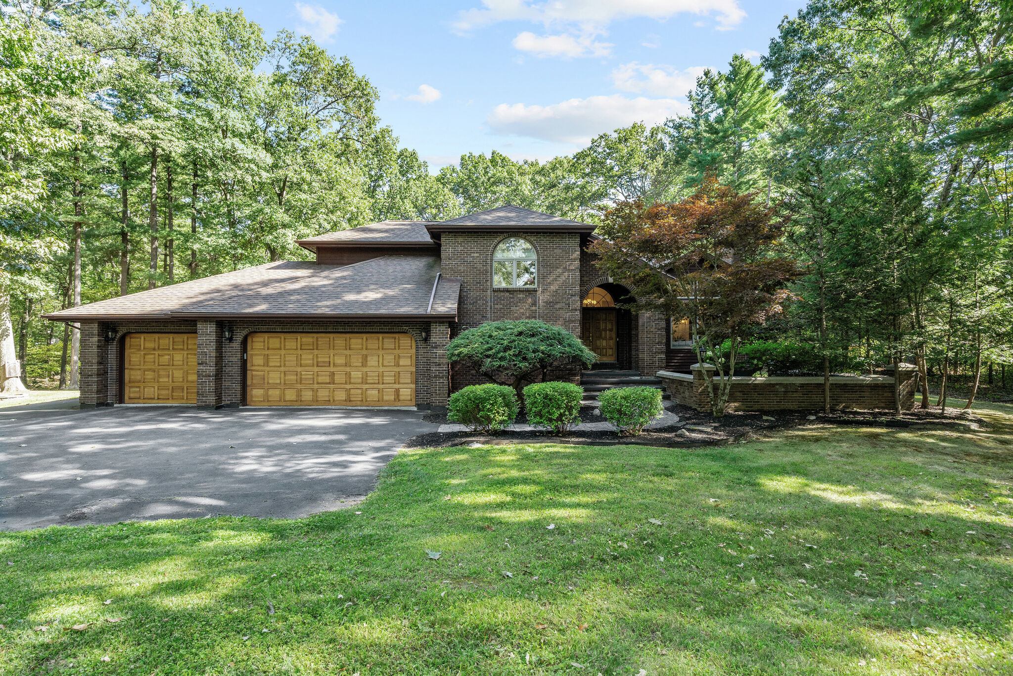 Brick-front '90s home in Castleton with 5 bedrooms listed for sale