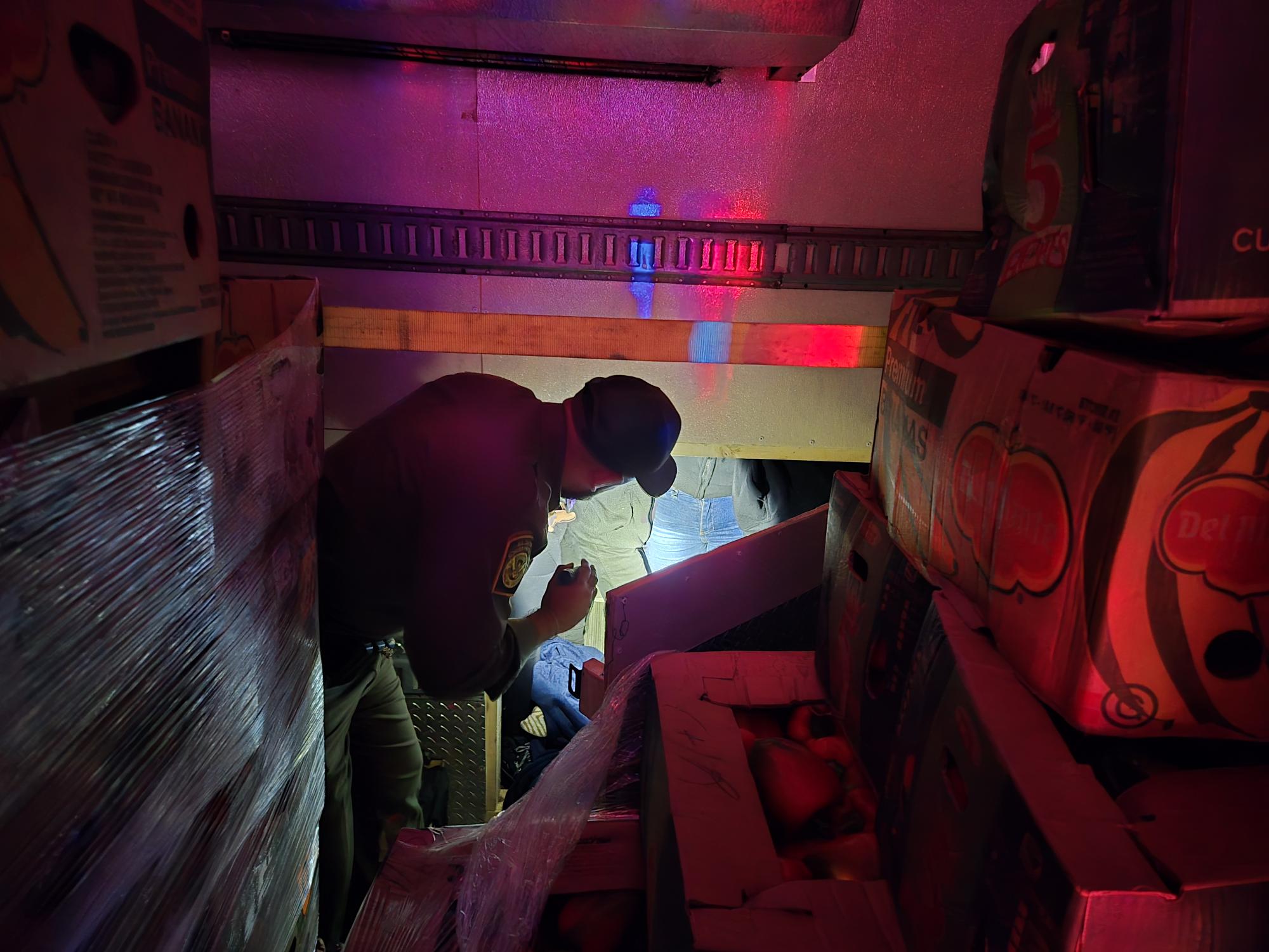 55 people found hidden in truck, one suspect was illegally in the US