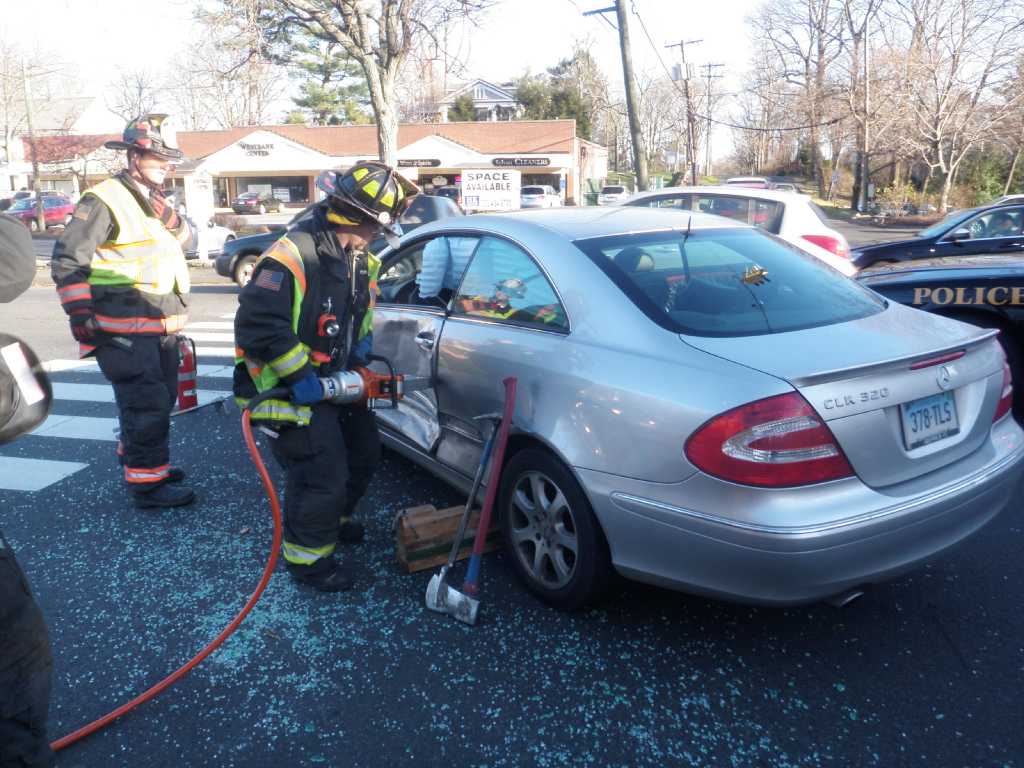 Woman extricated from car after Post Road crash