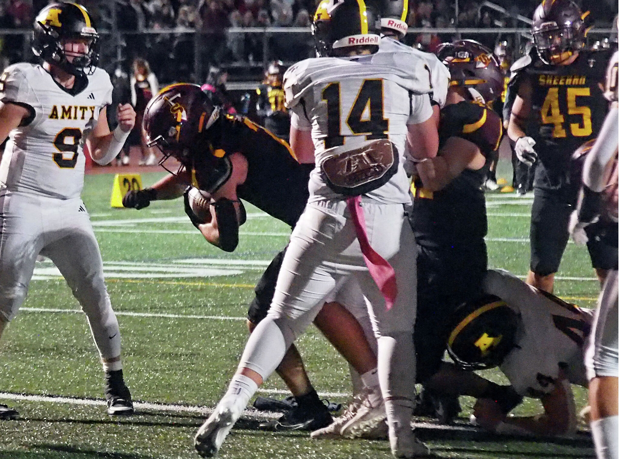Sheehan football topples Amity for 1st SCC victory