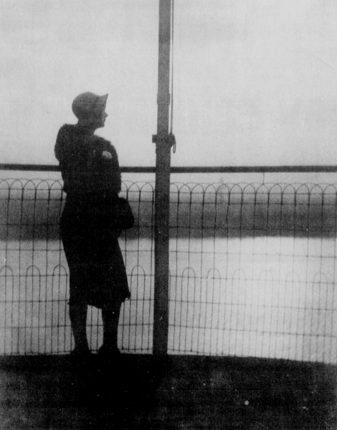 1933 photo shows Florence Lewis watching a Mississippi River sunset