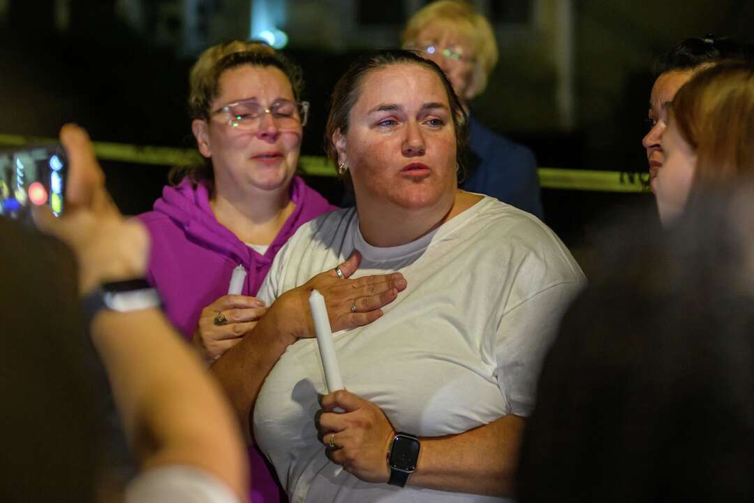 Photos: Hundreds mourn Albany fire victims at vigil