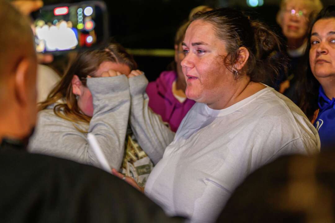 Photos: Hundreds mourn Albany fire victims at vigil