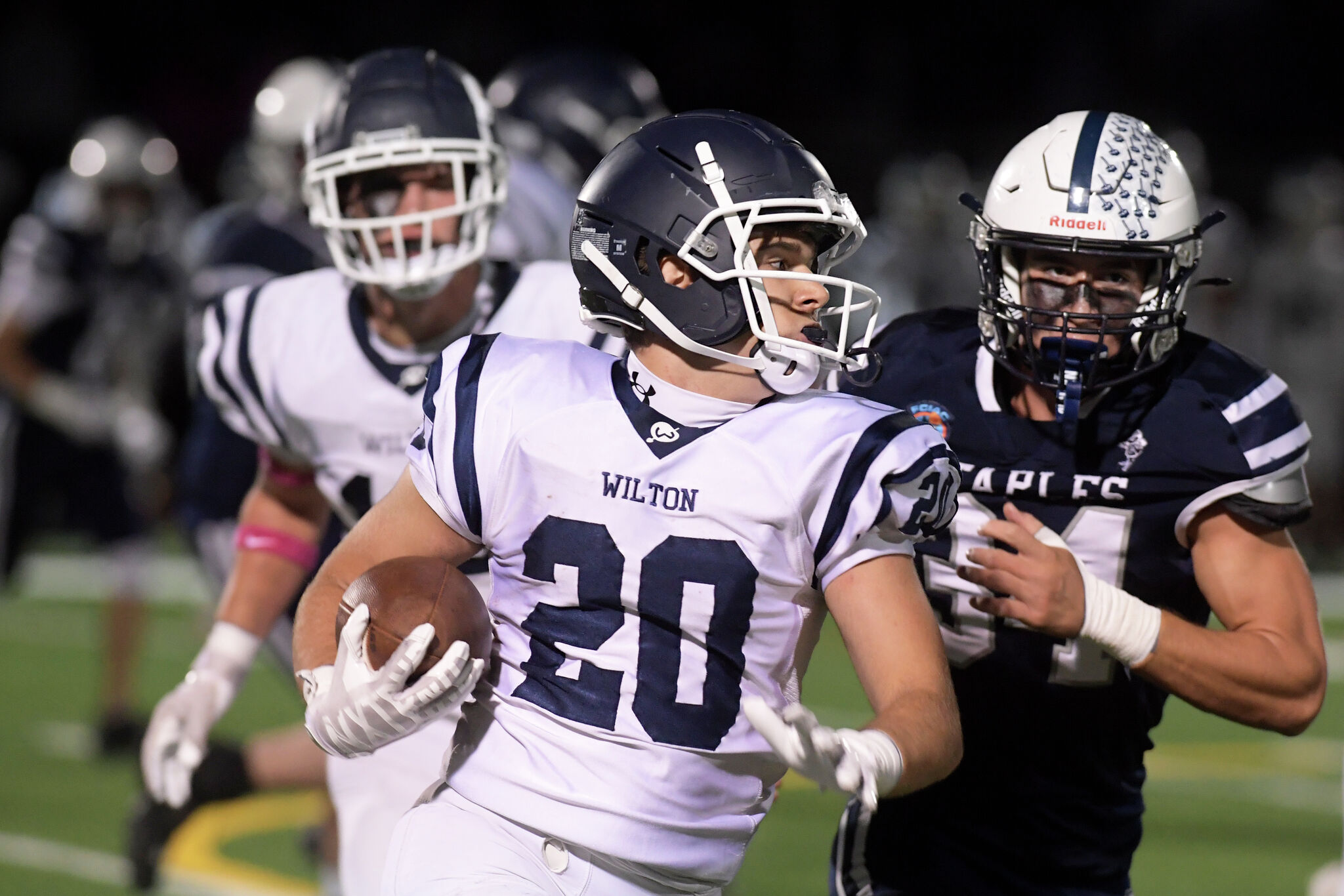 Wilton football runs wild in victory over Staples in Westport