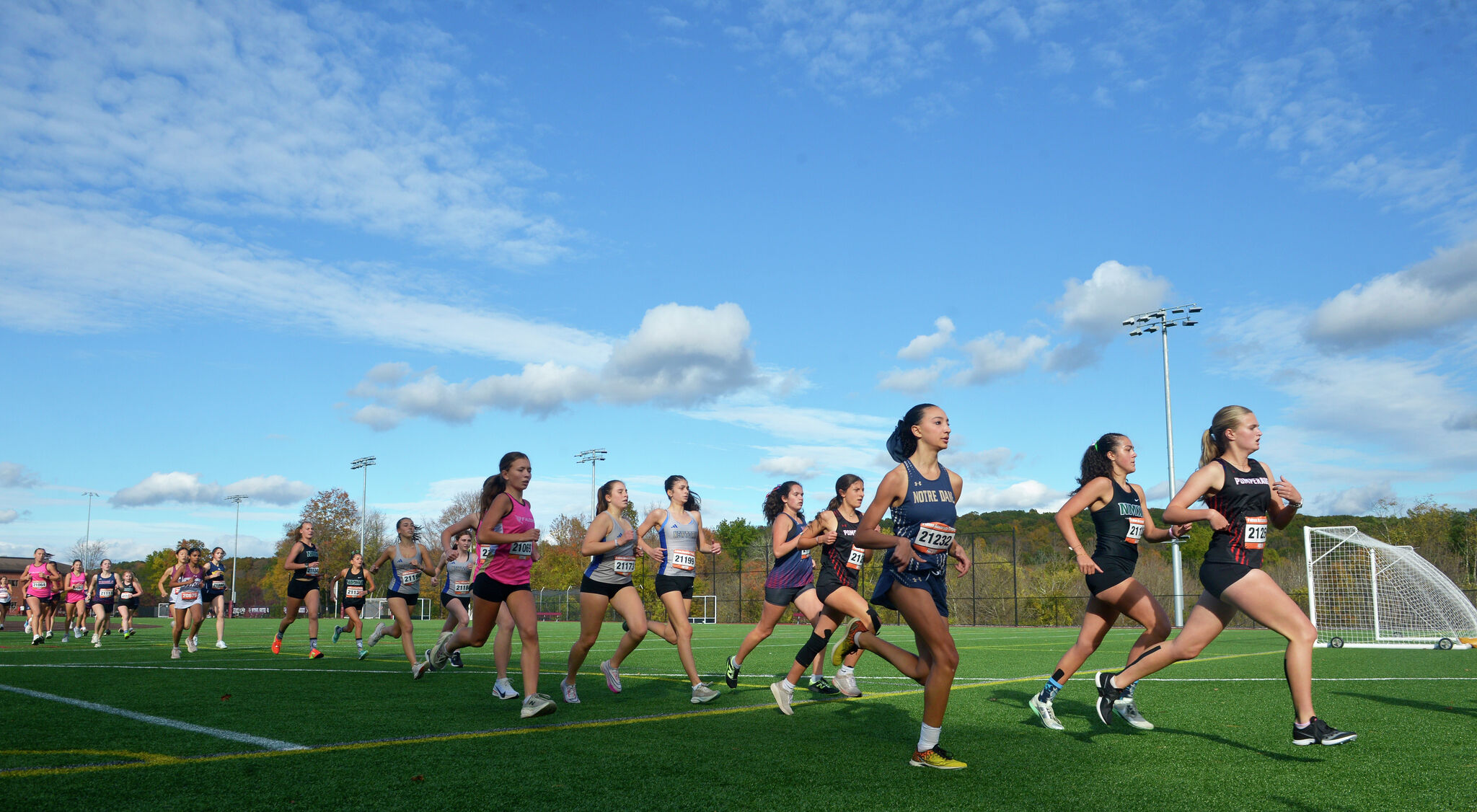 The Newtown boys and Pomperaug girls XC teams claim SWC titles