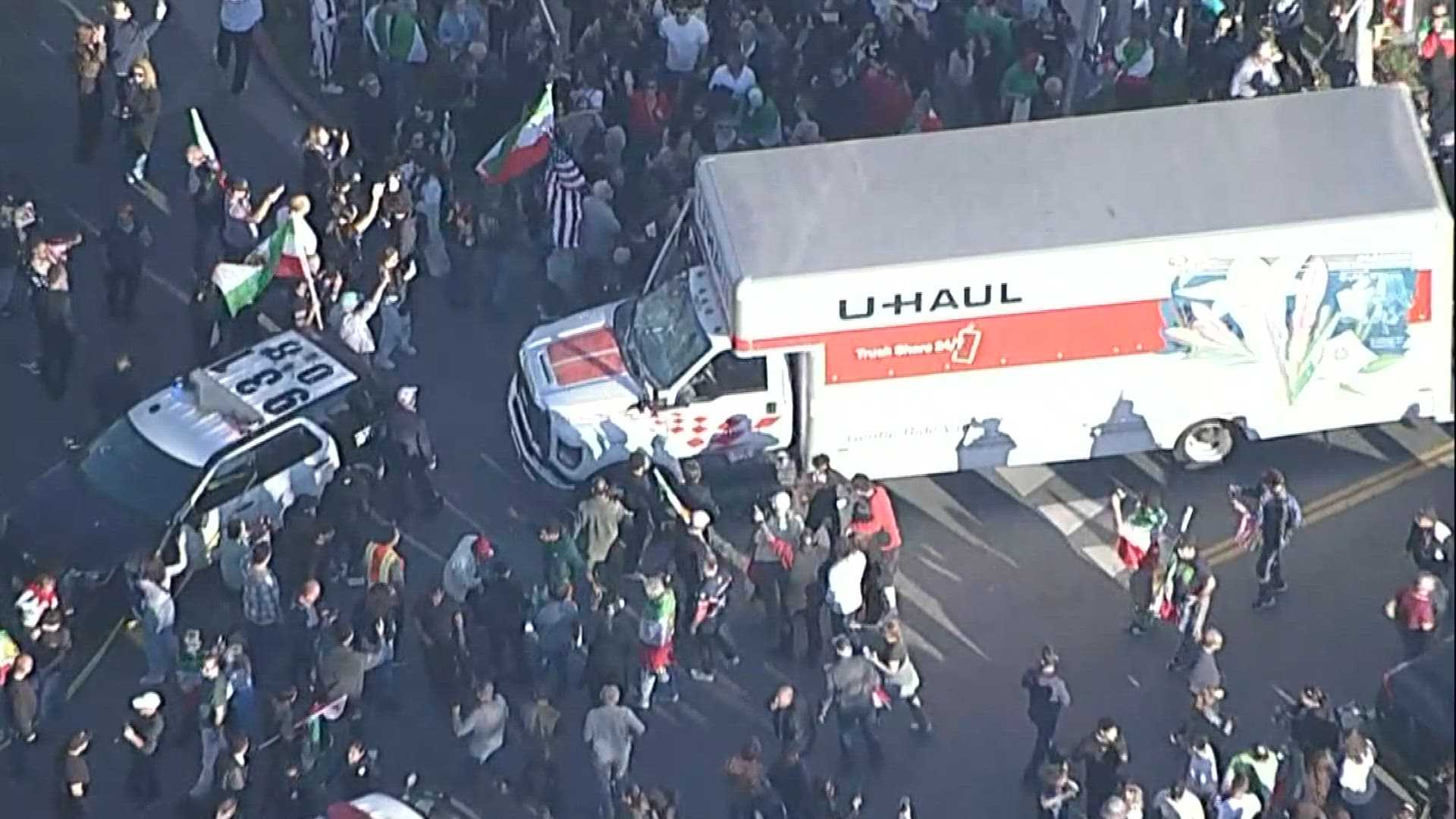 U-Haul drives through crowd of protesters in California