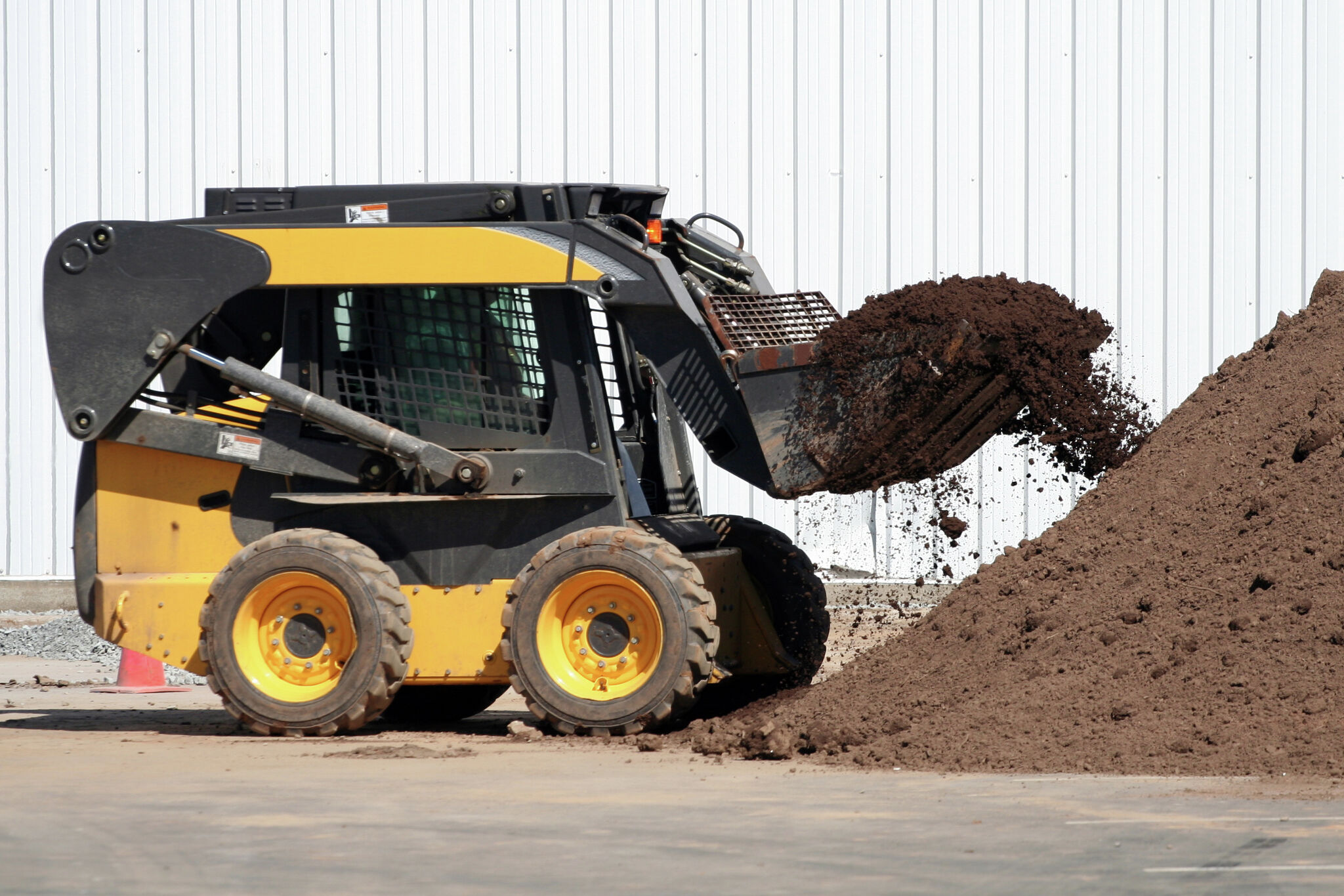 Midland man arrested after taking skid steer loader, police say