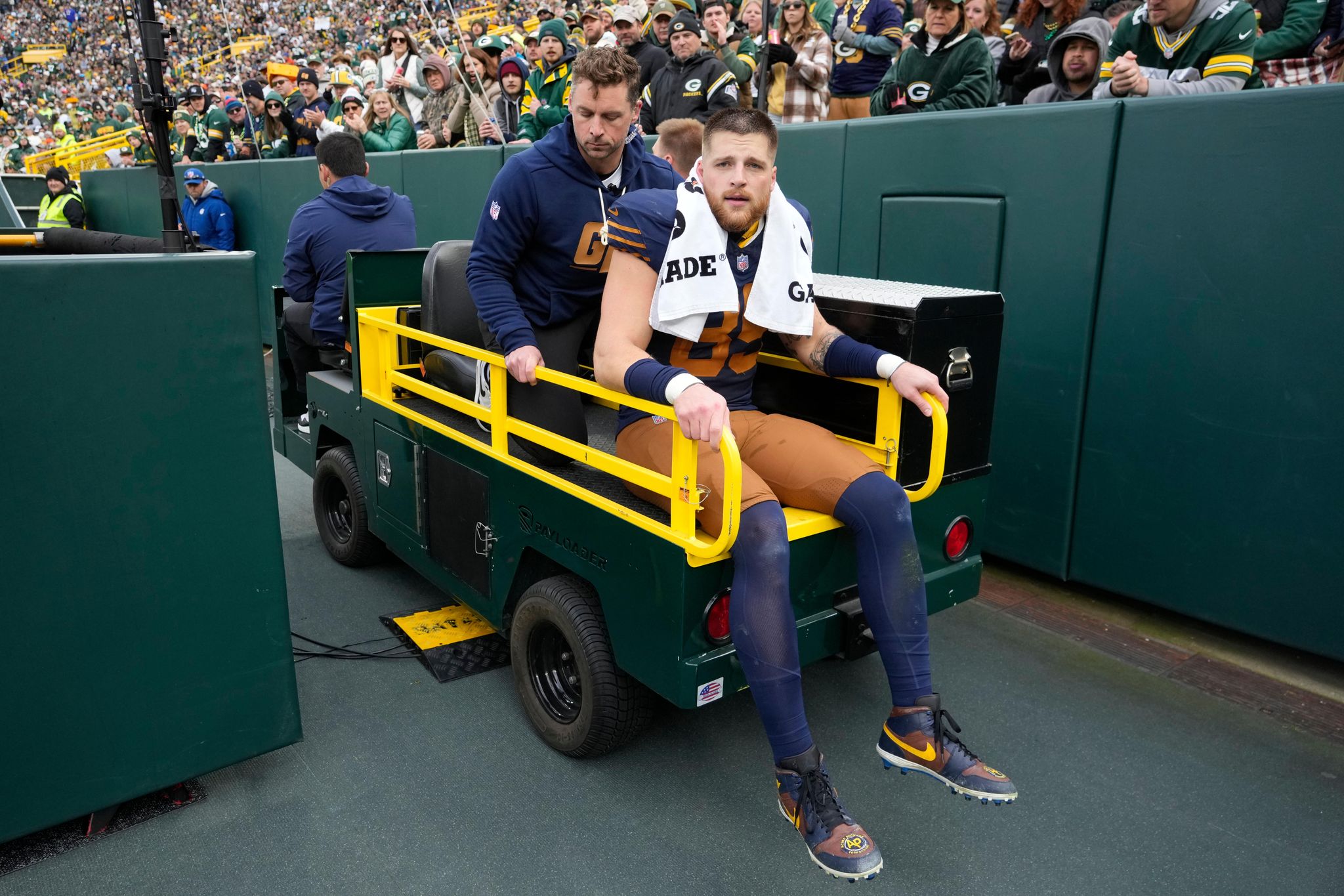 Packers star tight end Tucker Kraft carted into locker room with knee ...