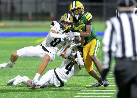 Woodland football runs past Holy Cross on road, remains undefeated