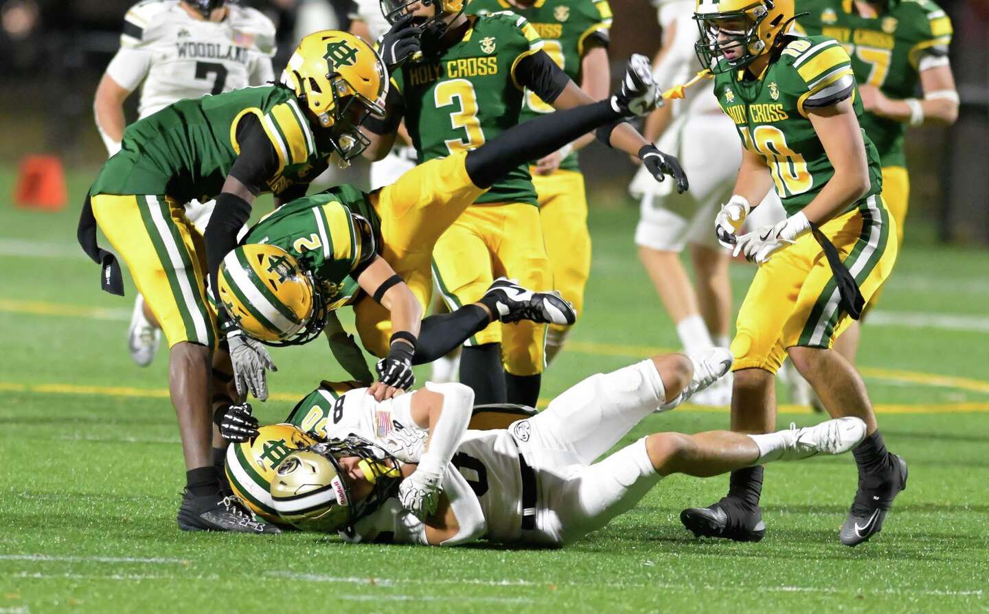 Woodland football runs past Holy Cross on road, remains undefeated