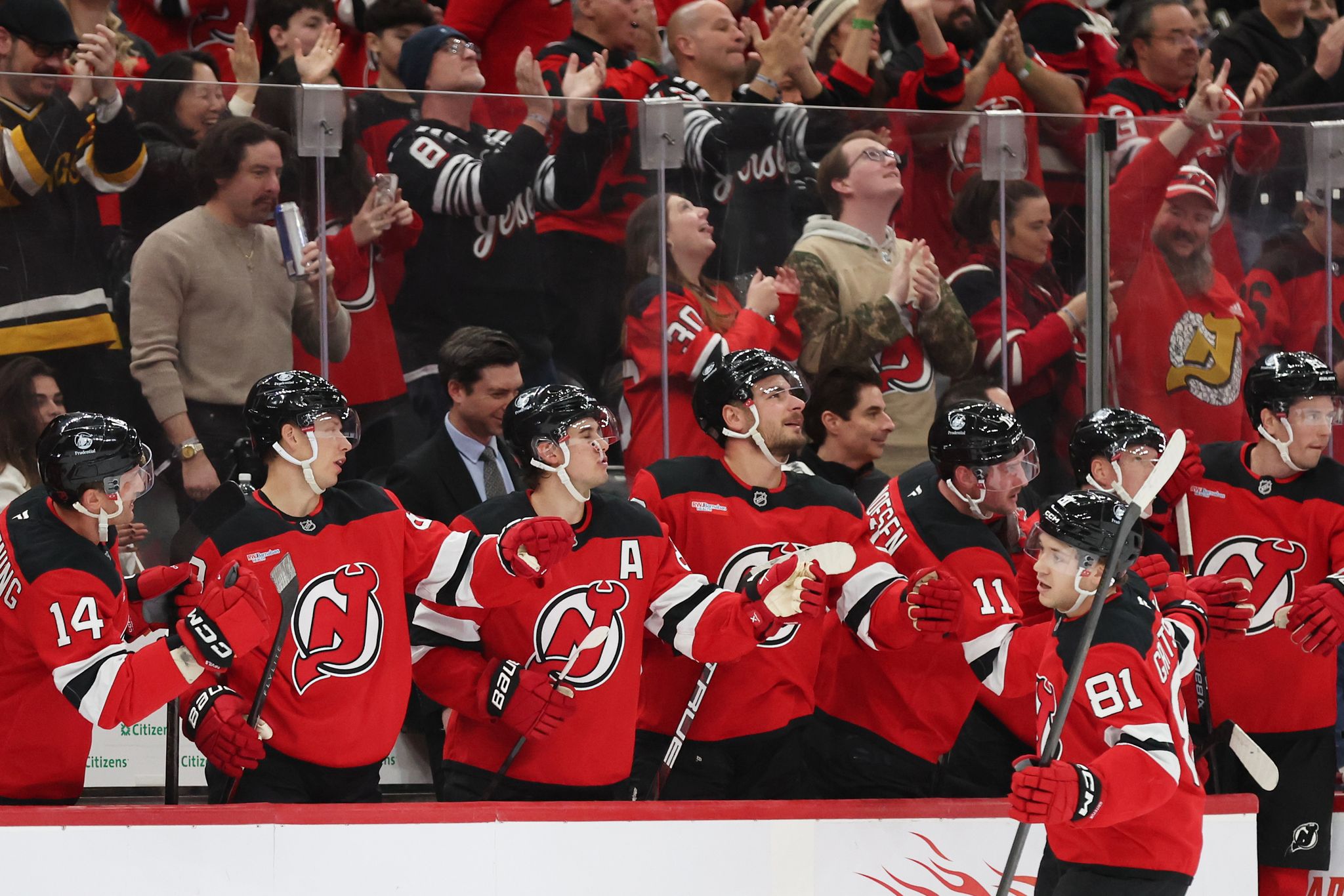 Devils beat the Penguins 2-1 in a shootout to take over 1st place in ...
