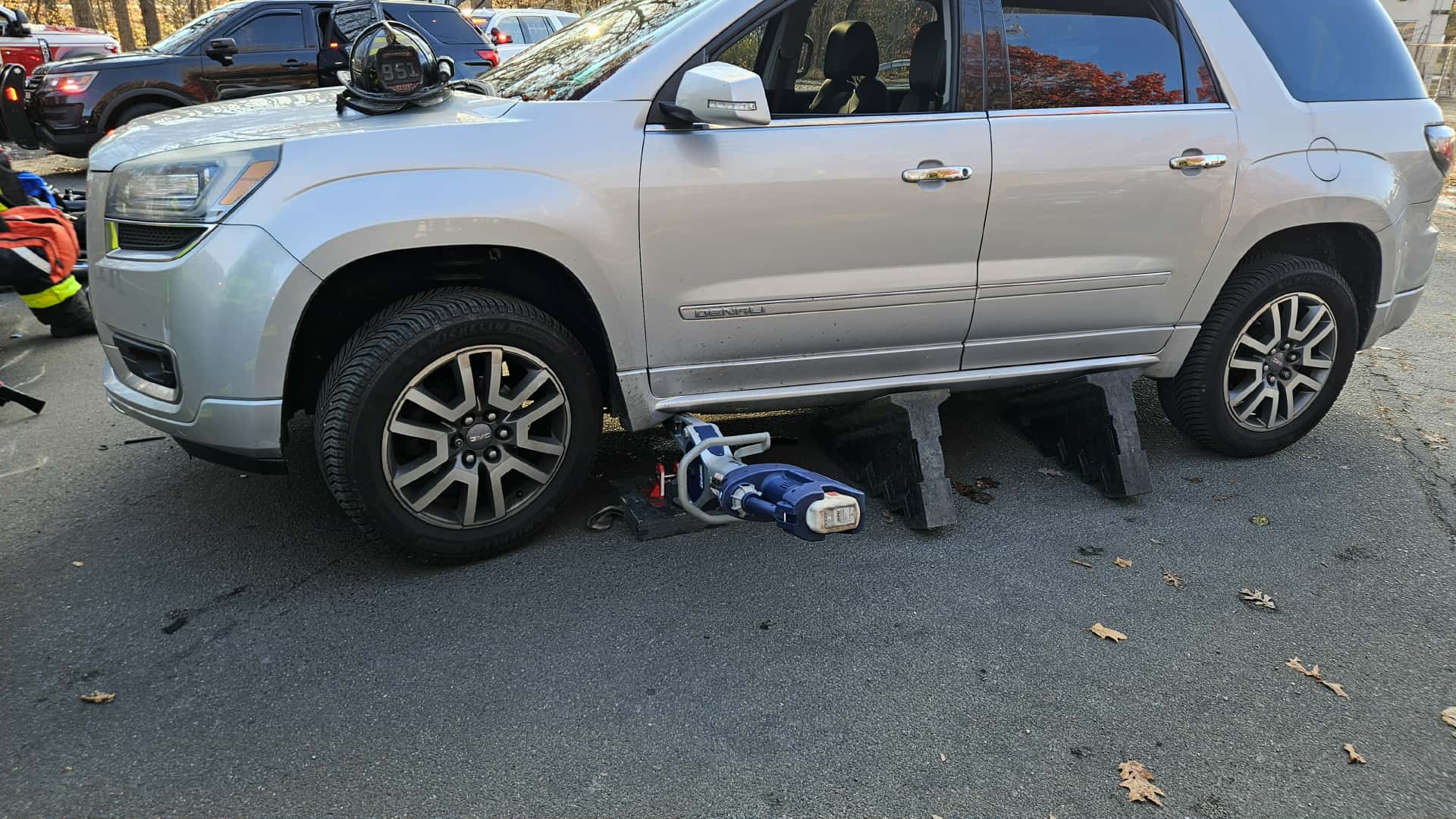 Motorcyclist pinned under car following Clinton crash, officials say