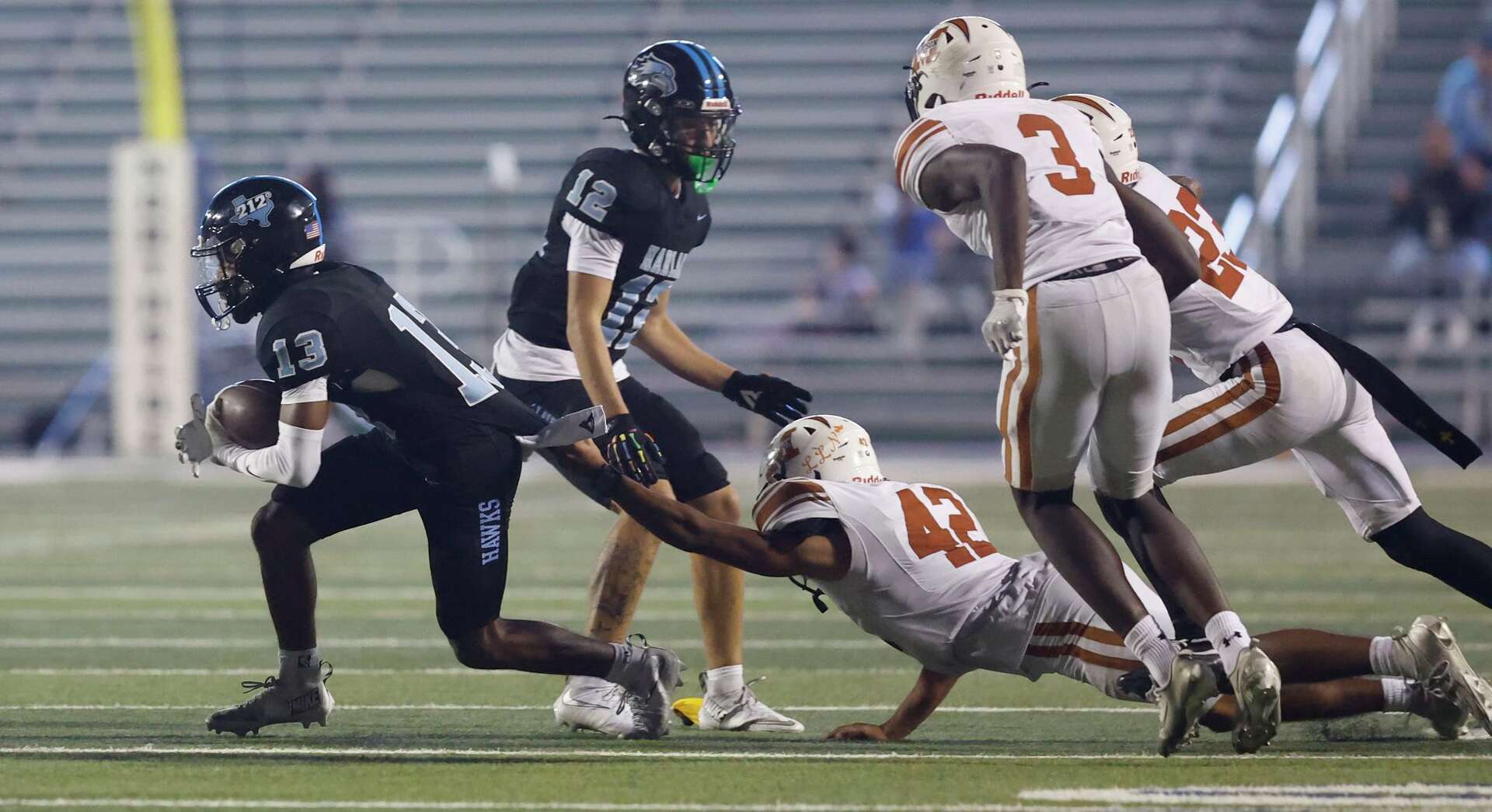 Harlan football routs Madison to advance to second round of playoffs