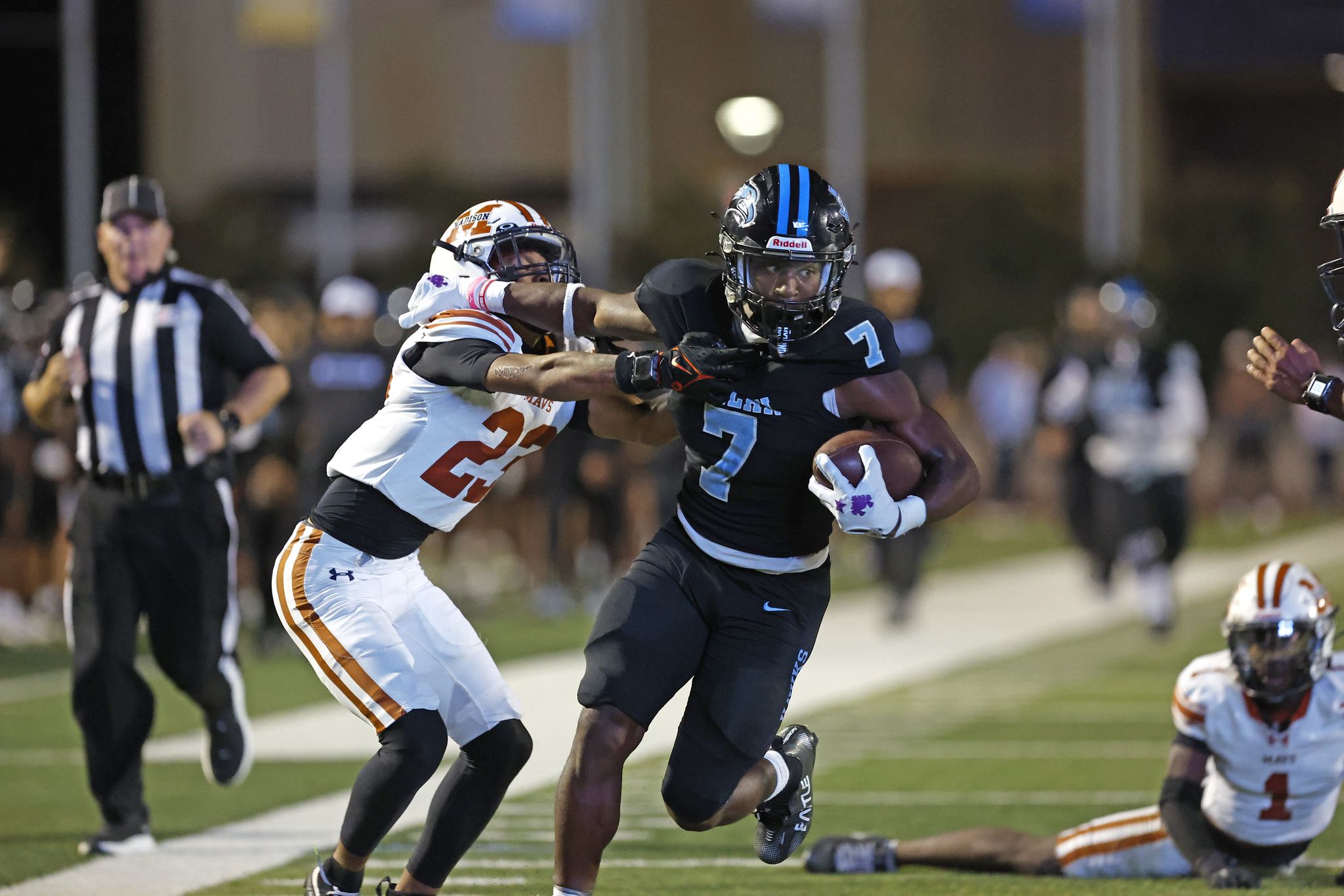 Harlan football routs Madison to advance to second round of playoffs