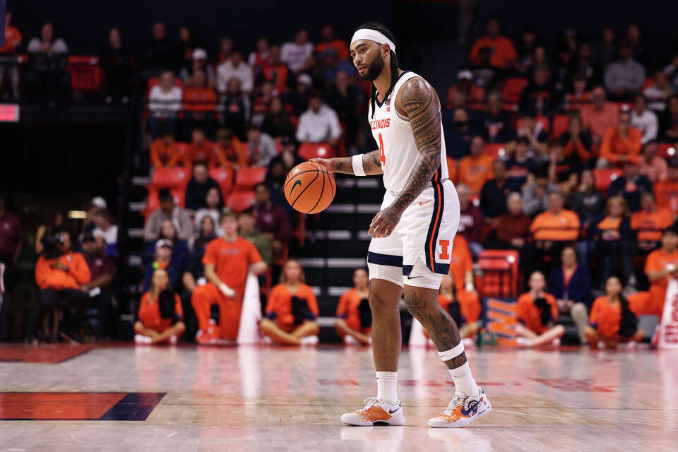 Illinois' Kylan Boswell wears Chief Illiniwek shoes