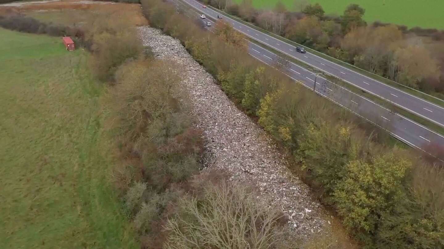 Mountain of illegally dumped trash near Oxford river causes outcry in ...